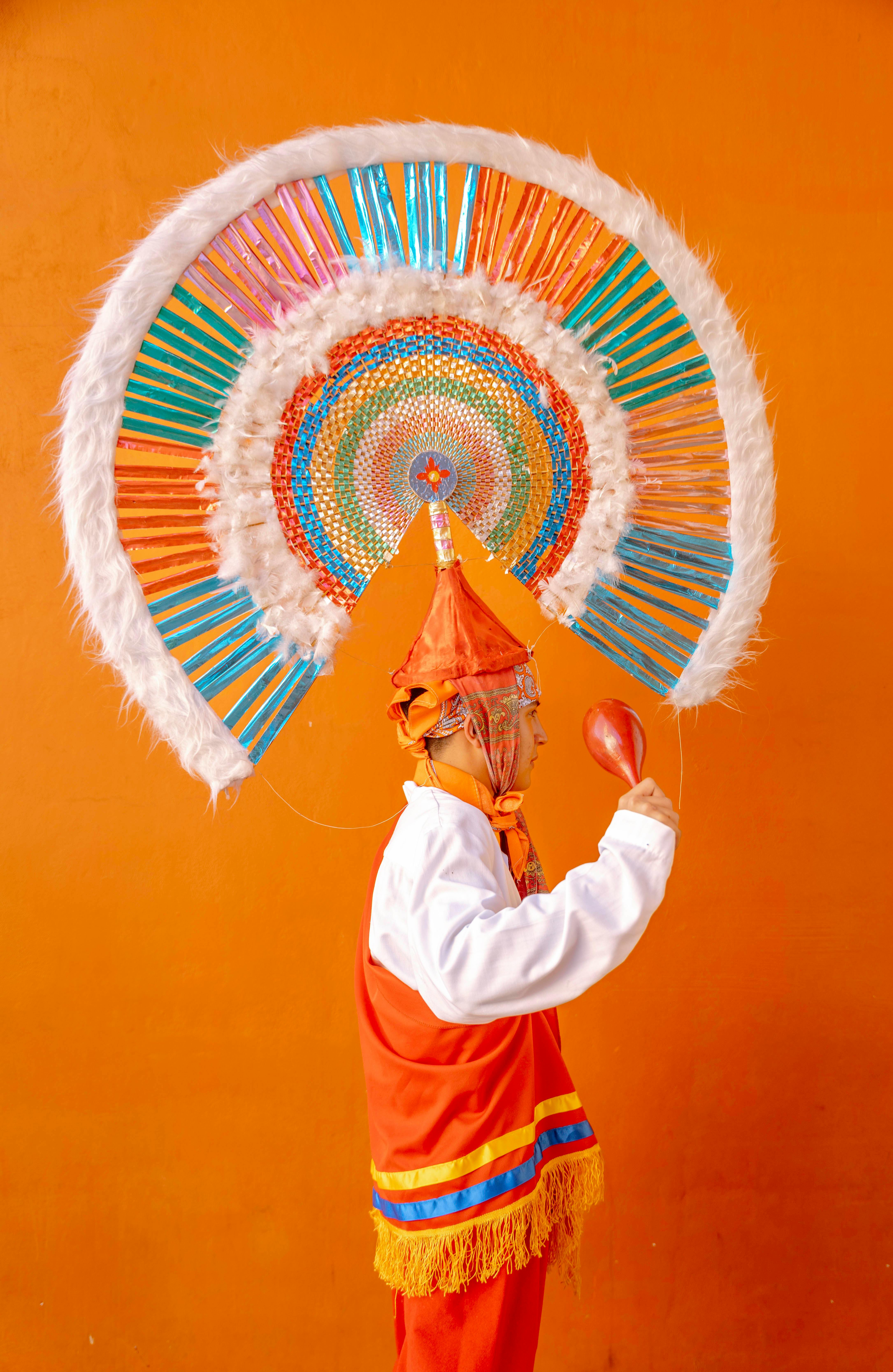 Man in Traditional Clothing and Hat with Plume · Free Stock Photo