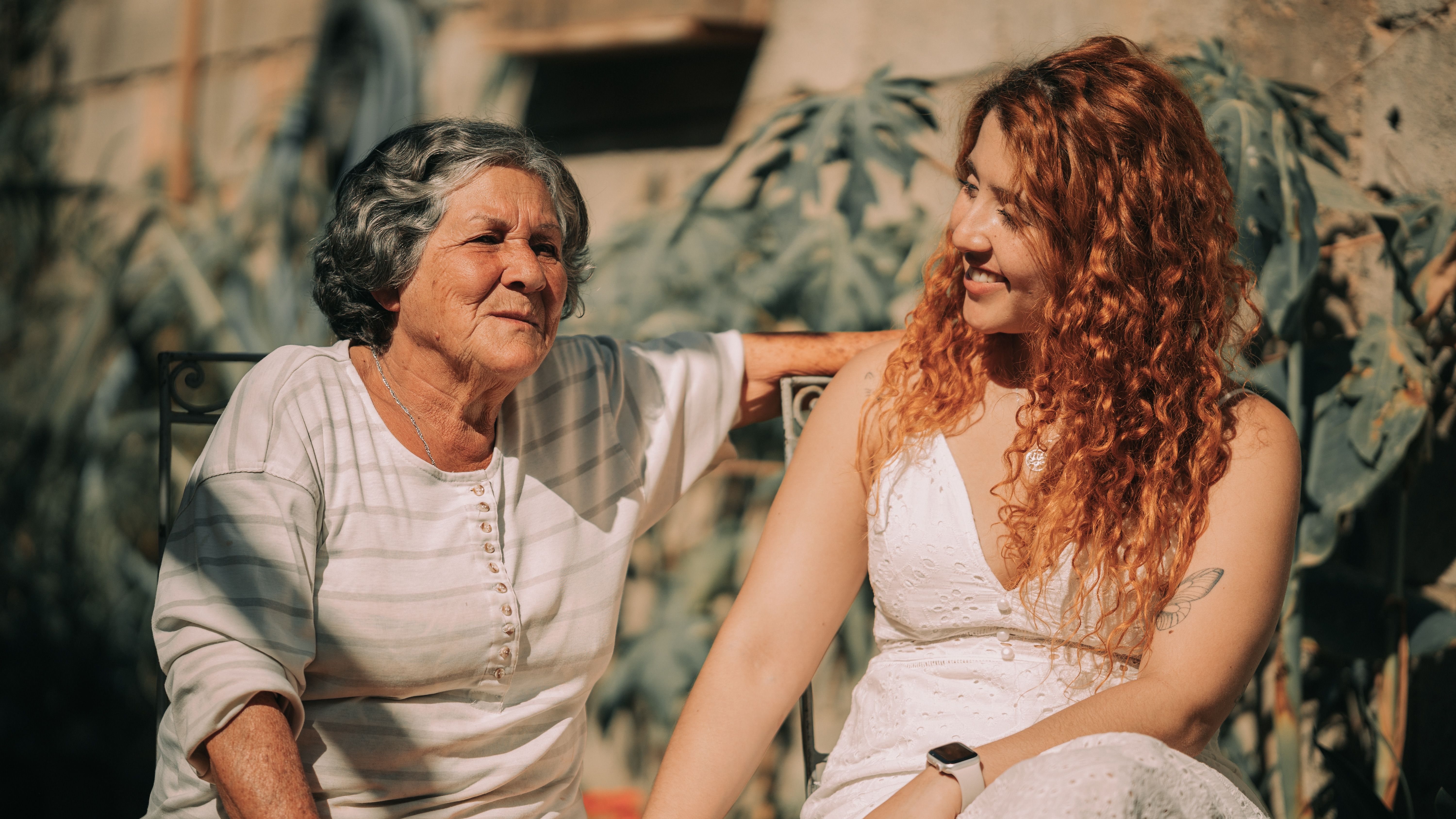 Mother Sitting with Daughter in Dress · Free Stock Photo