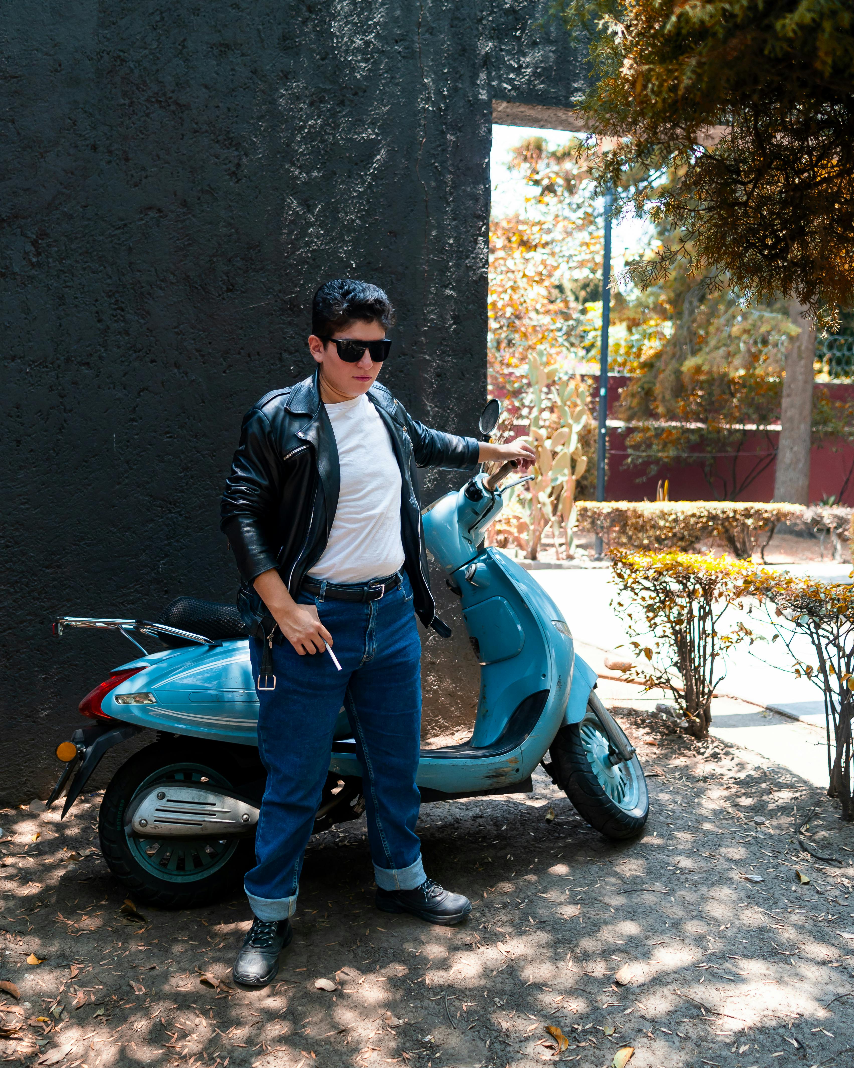 Man in Leather Jacket Standing with Motor Scooter · Free Stock Photo