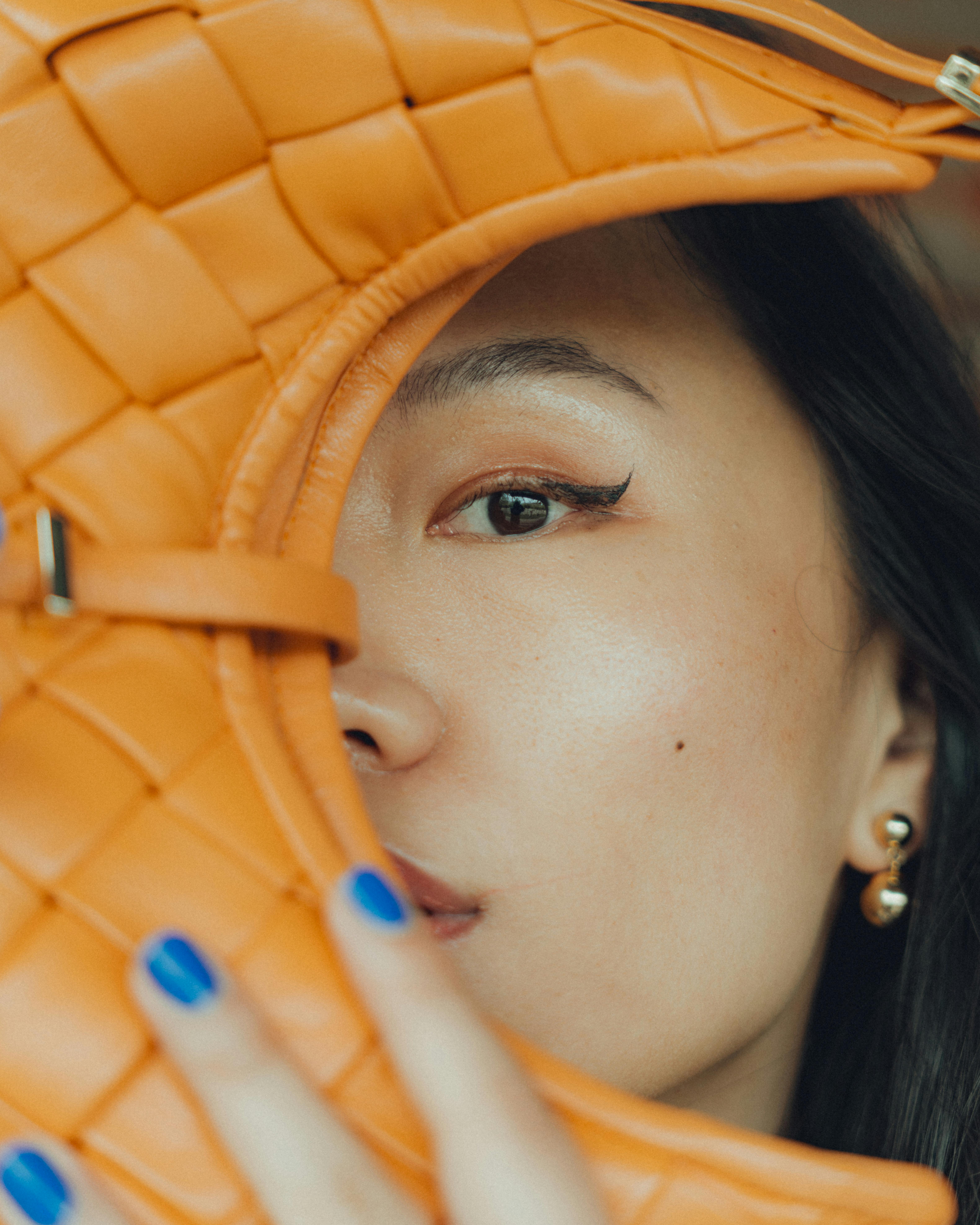Woman Face behind Bag · Free Stock Photo