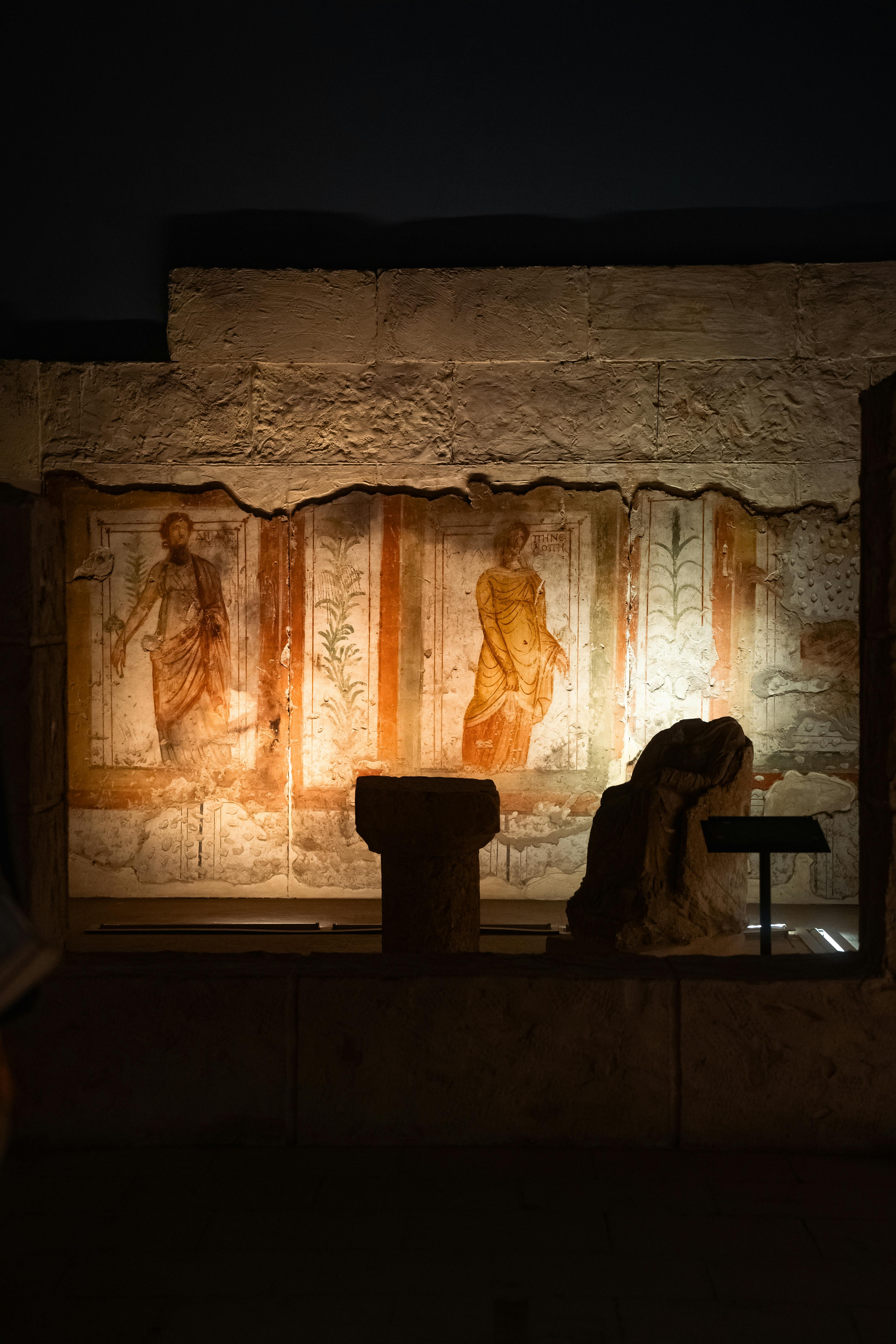 Ancient Roman Frescoes in Dimly Lit Exhibit · Free Stock Photo