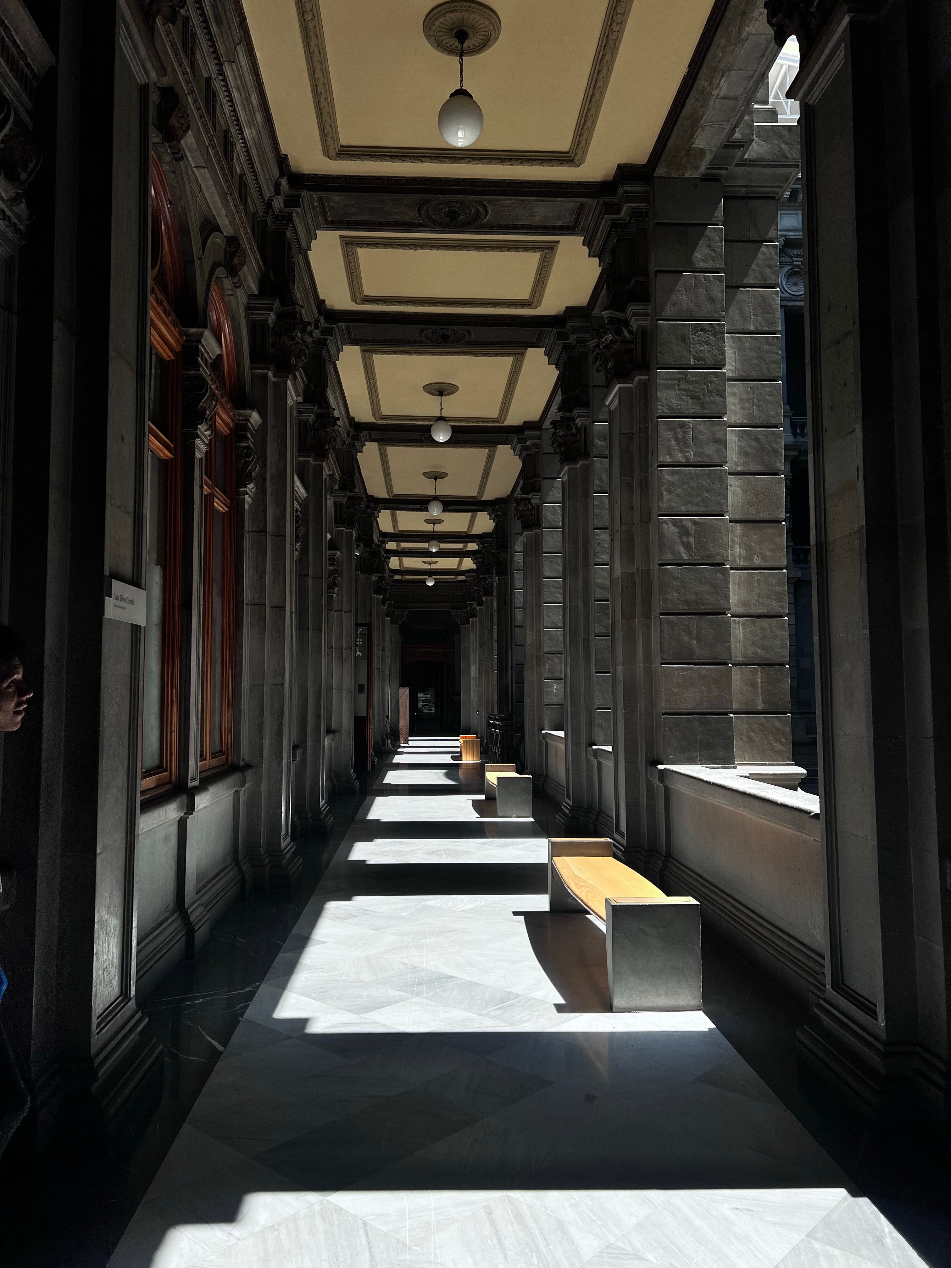 Vintage Building Corridor with Benches · Free Stock Photo