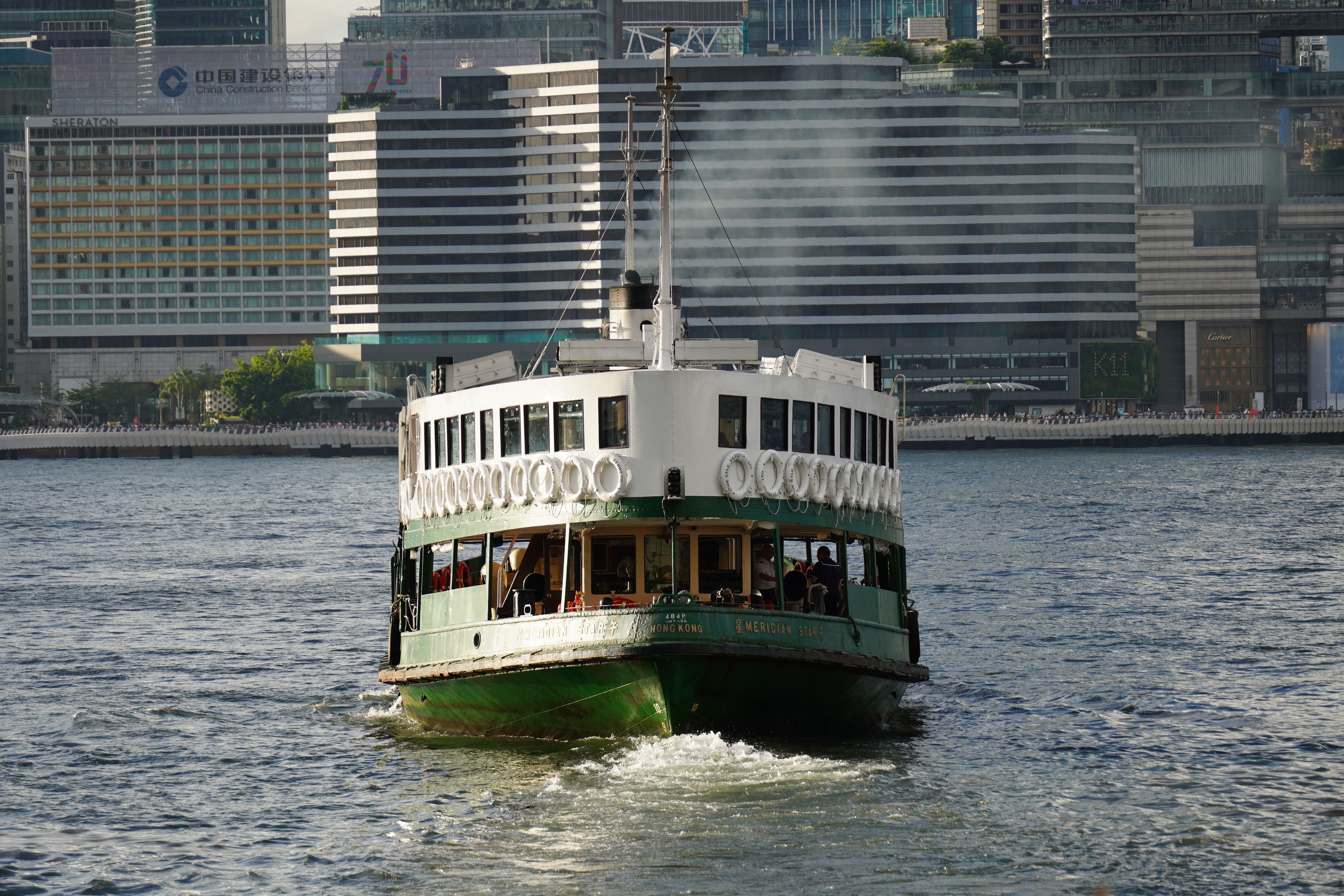 Green Ferry against City · Free Stock Photo