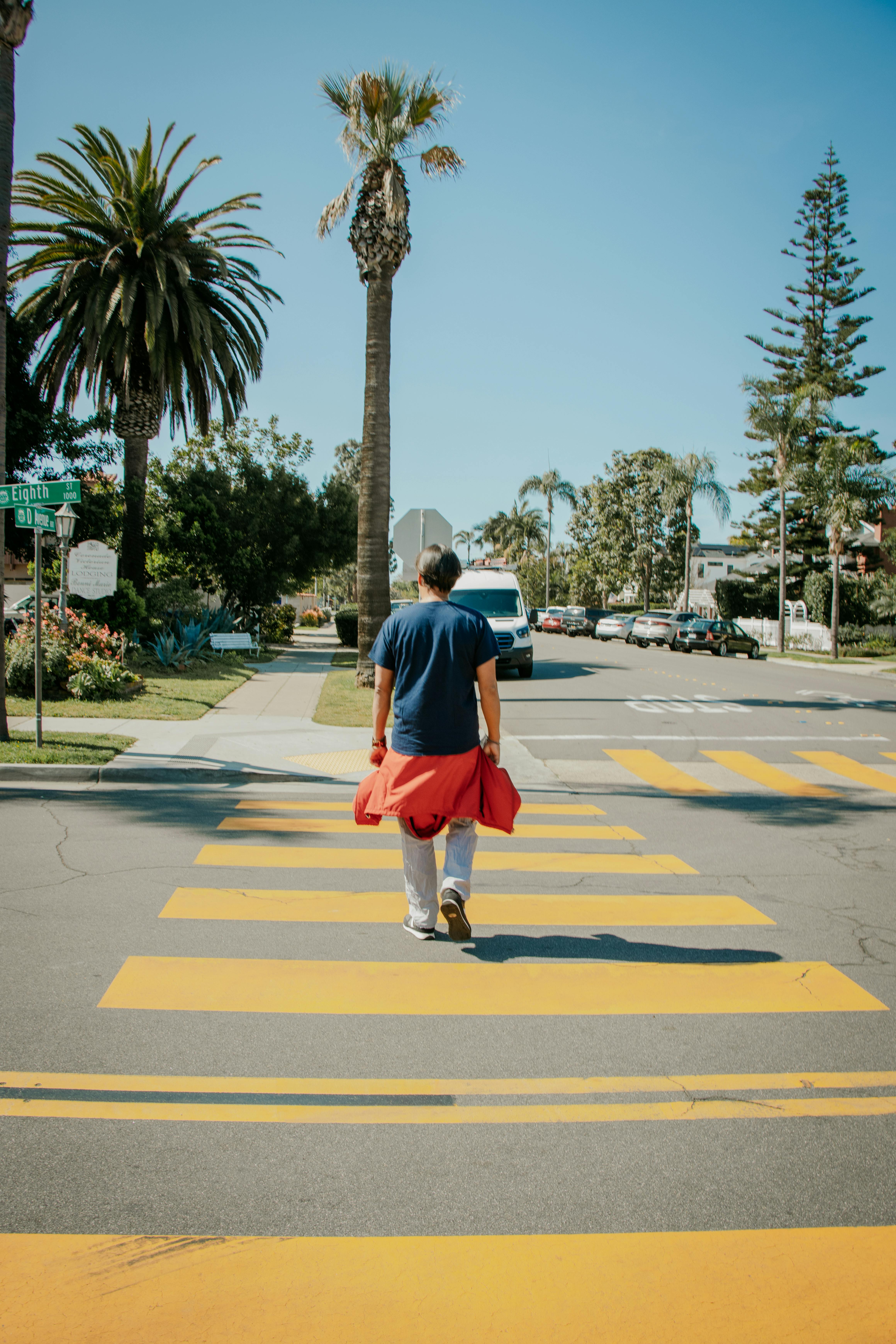 Person walking down a Californian Street during the summer · Free Stock ...