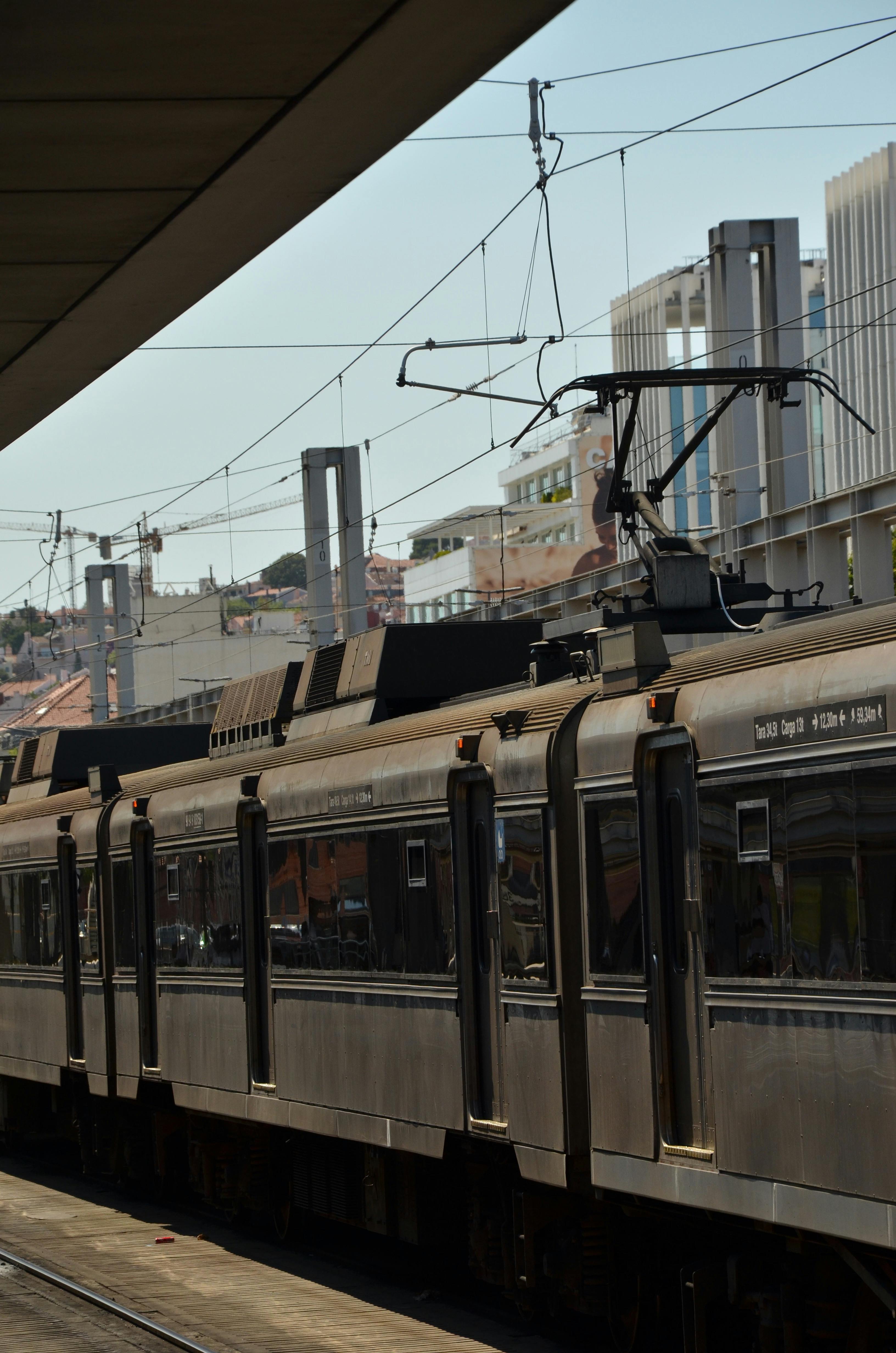 Black and Gray Train on Rail Tracks · Free Stock Photo