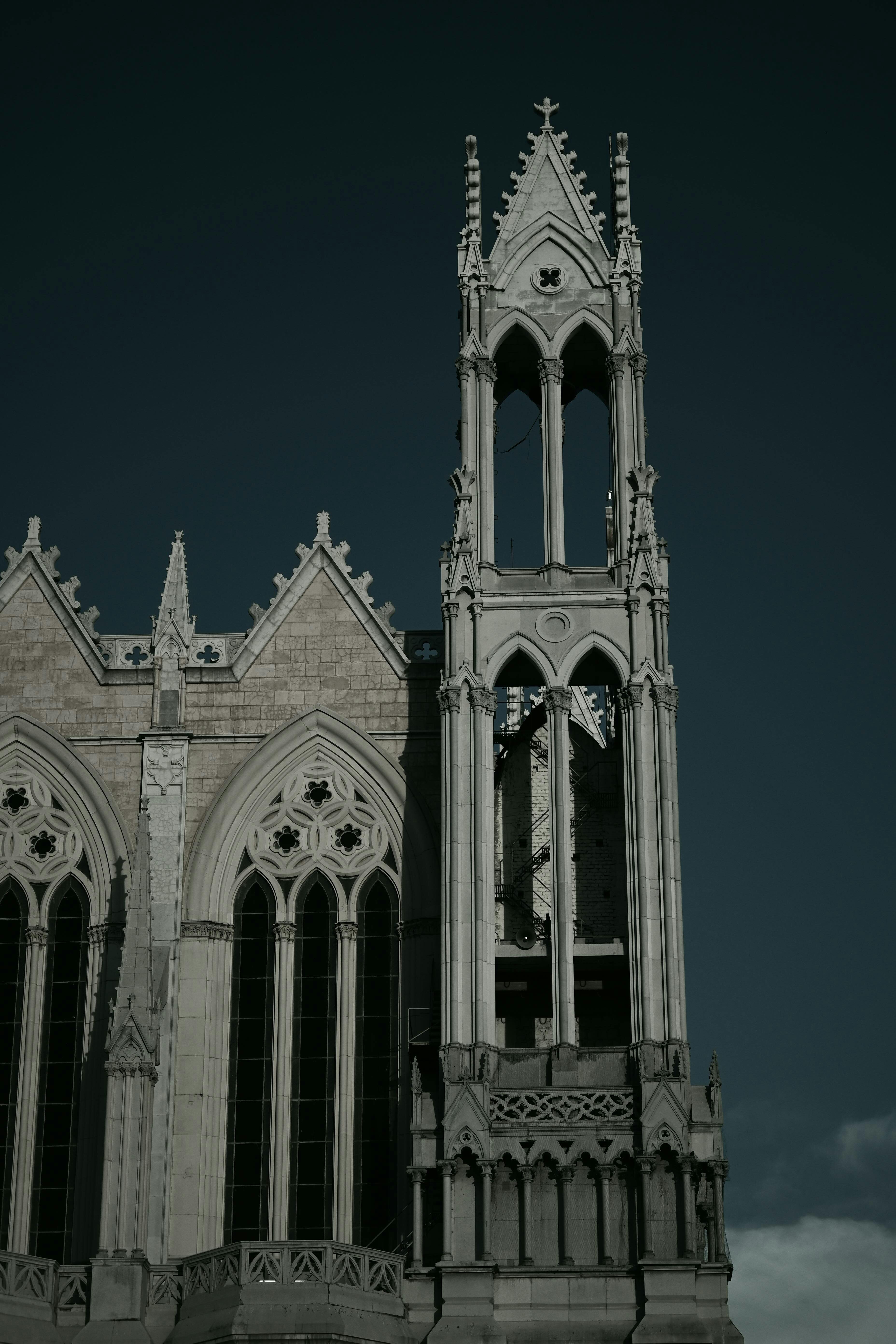 A tall church with a clock tower and a clock · Free Stock Photo