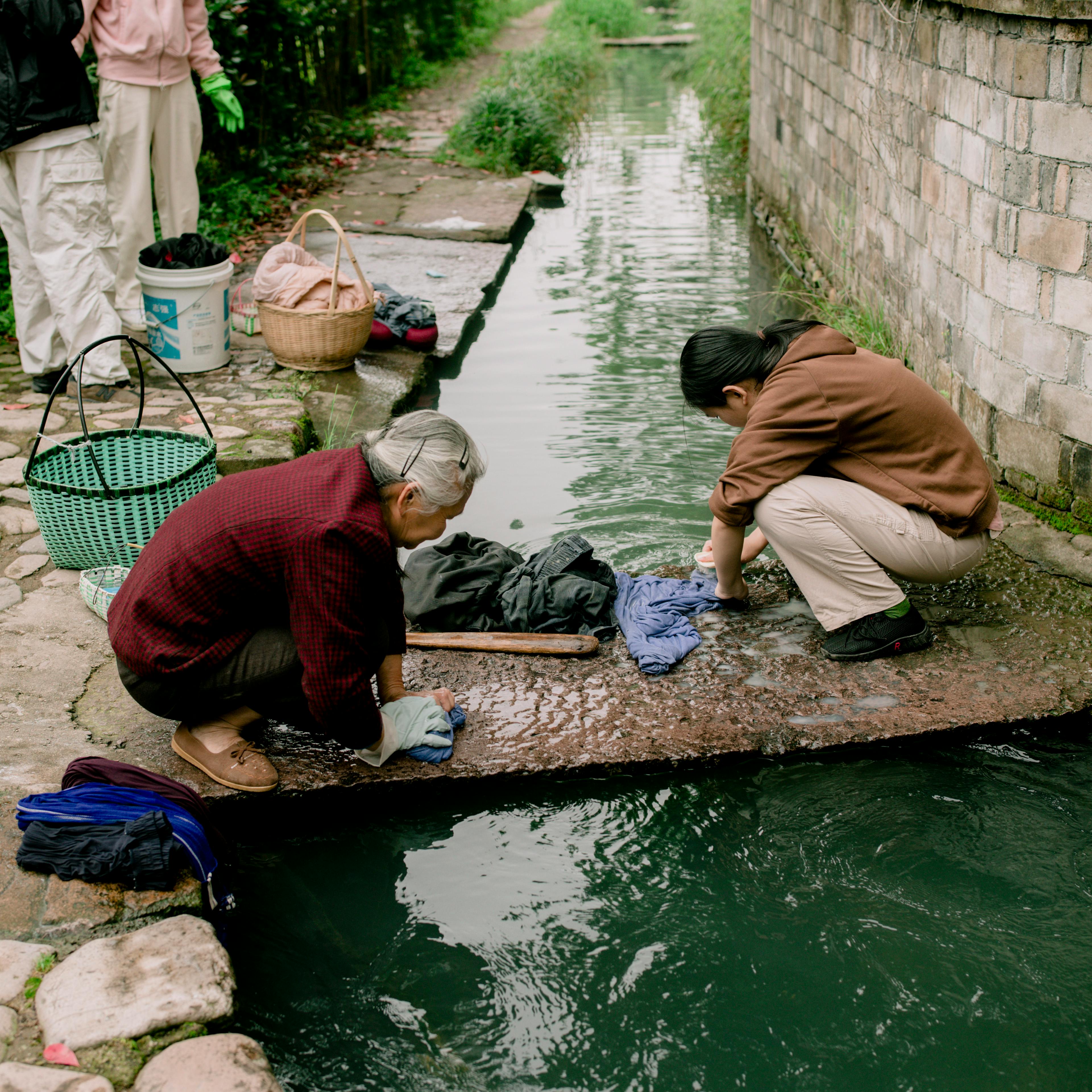 Women Washing Clothes in River · Free Stock Photo