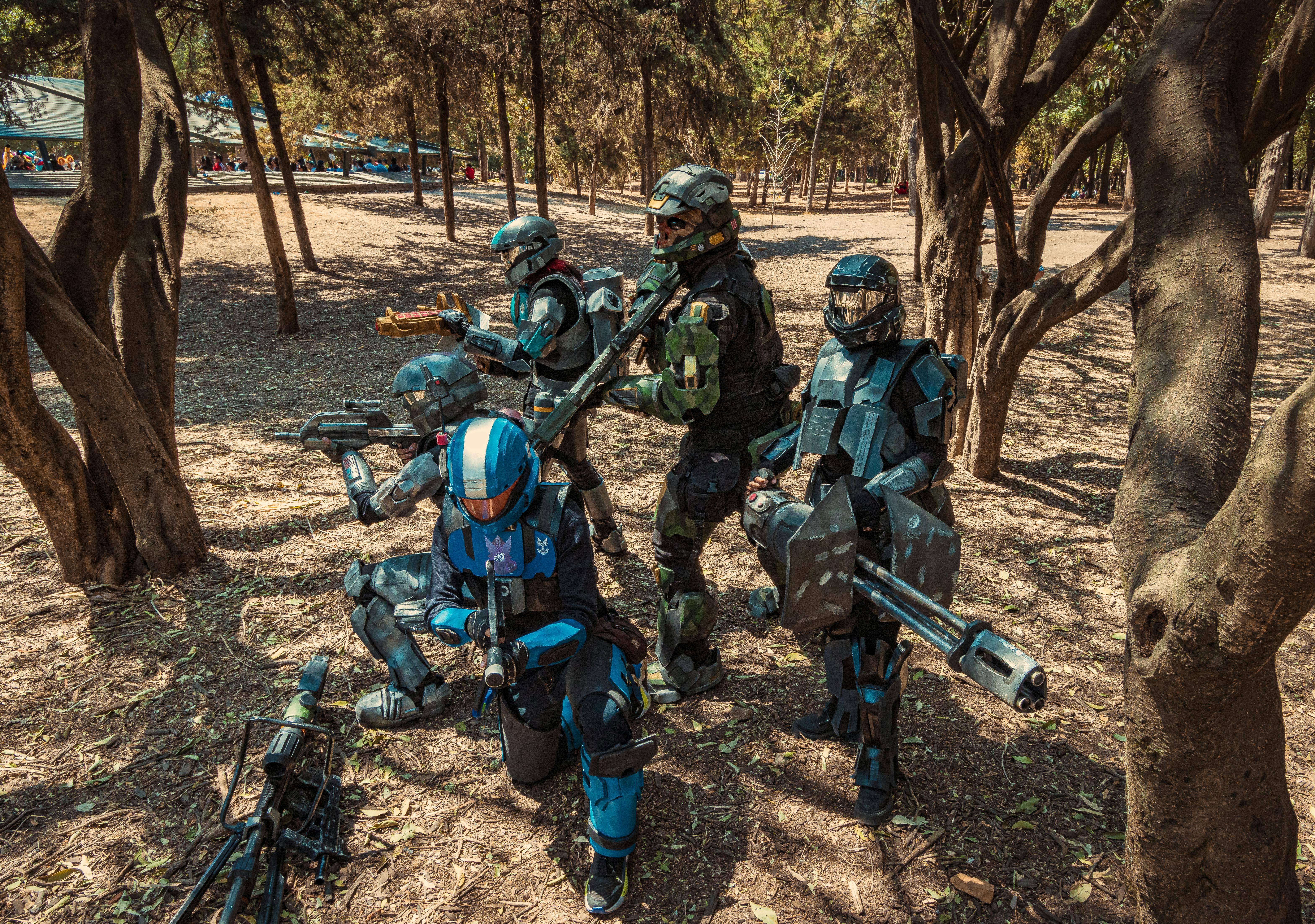 Group of People in Halo Costumes with Rifles Posing · Free Stock Photo