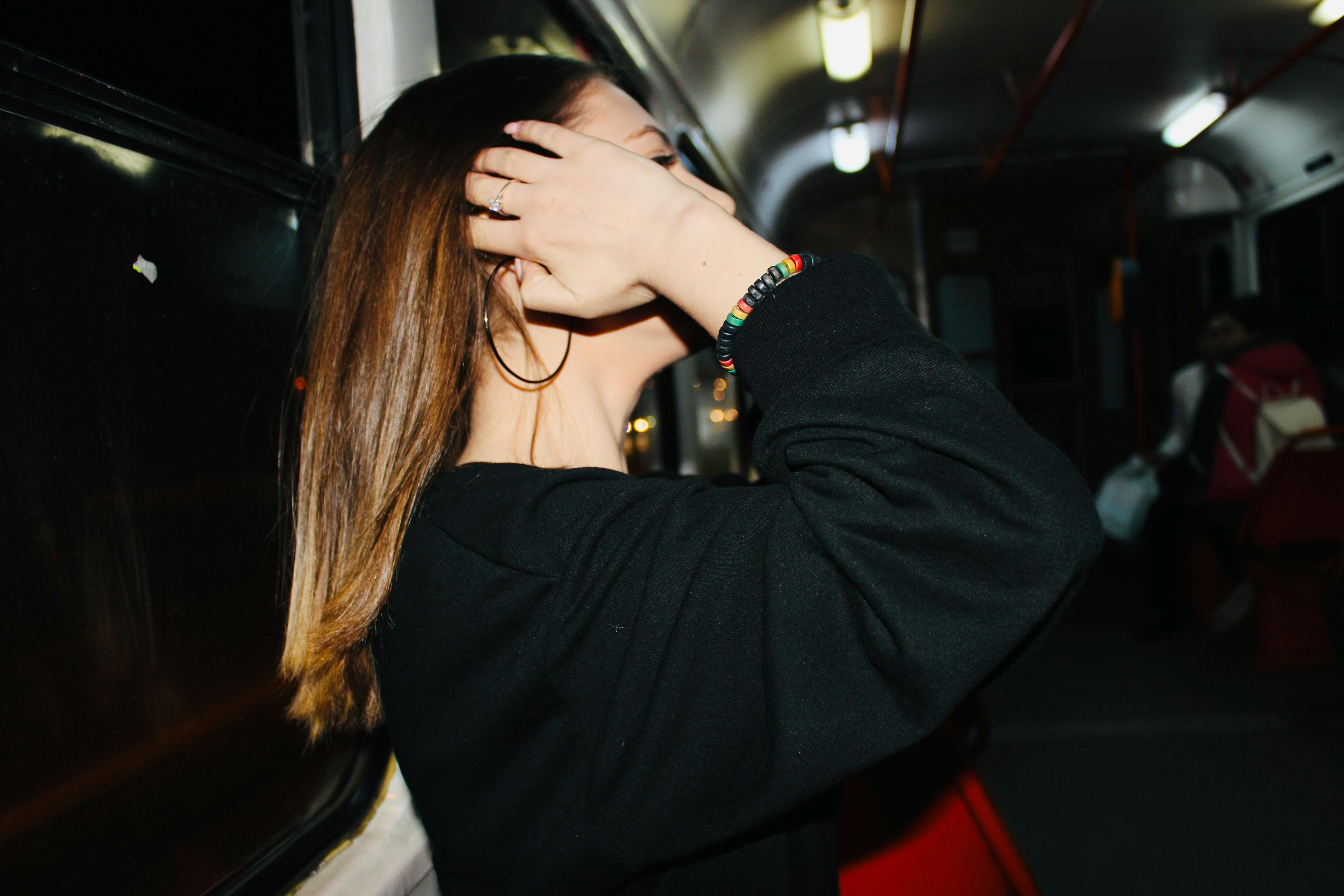 Photo of a Woman Standing Inside Bus · Free Stock Photo