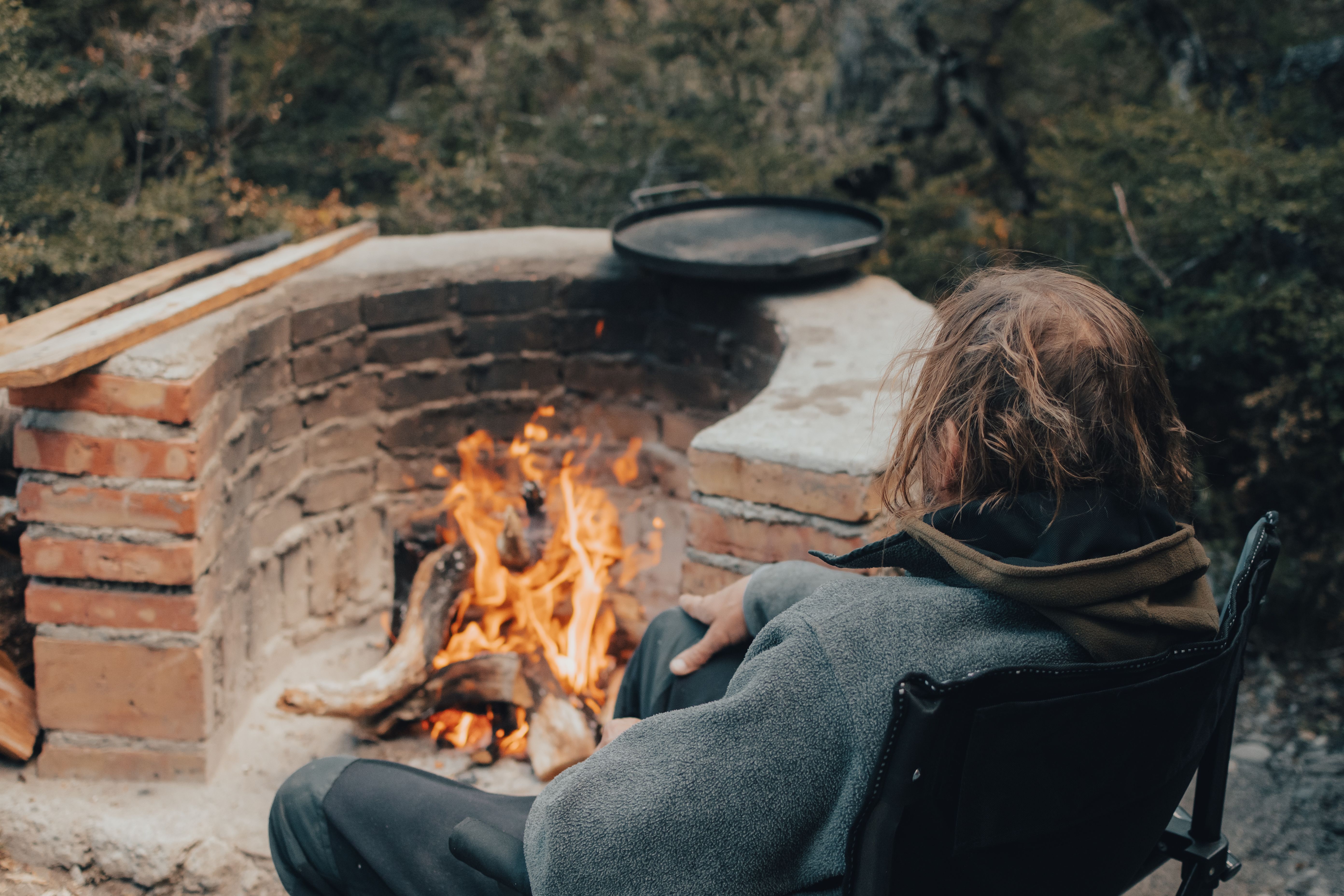 Man Relaxing by Fire · Free Stock Photo