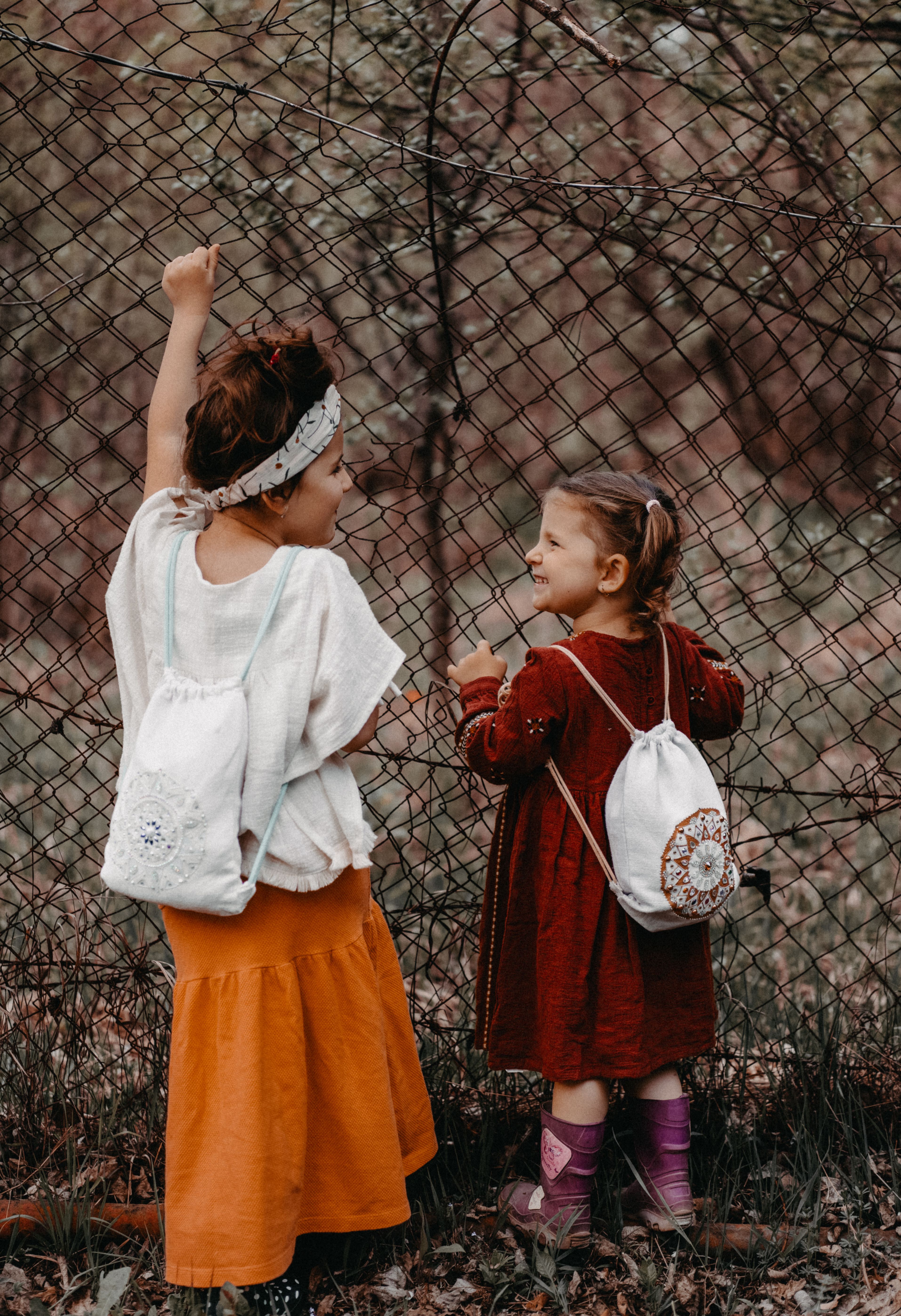 Back View of Kids by a Fence · Free Stock Photo