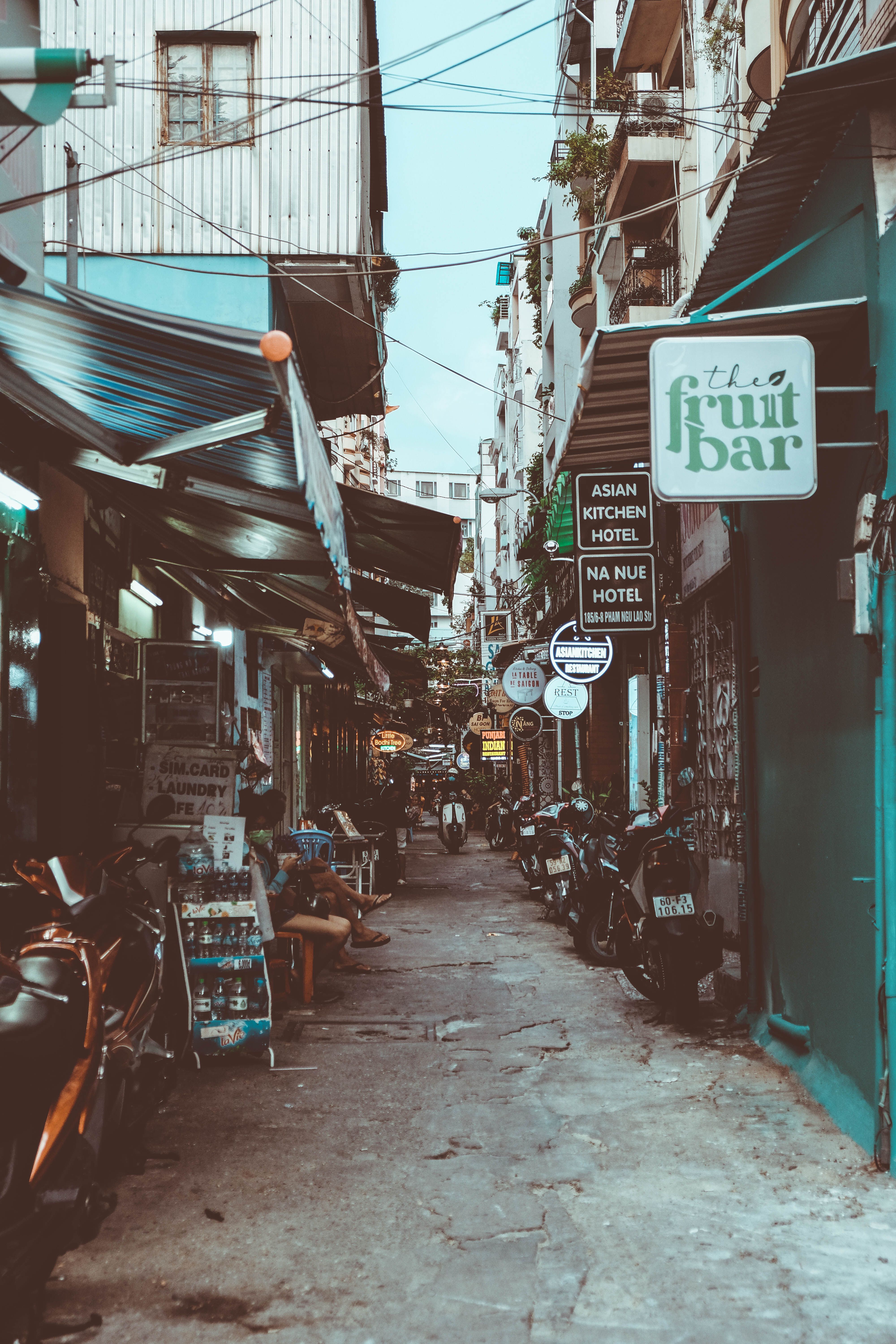 Narrow Alley with Shops and Cafes · Free Stock Photo