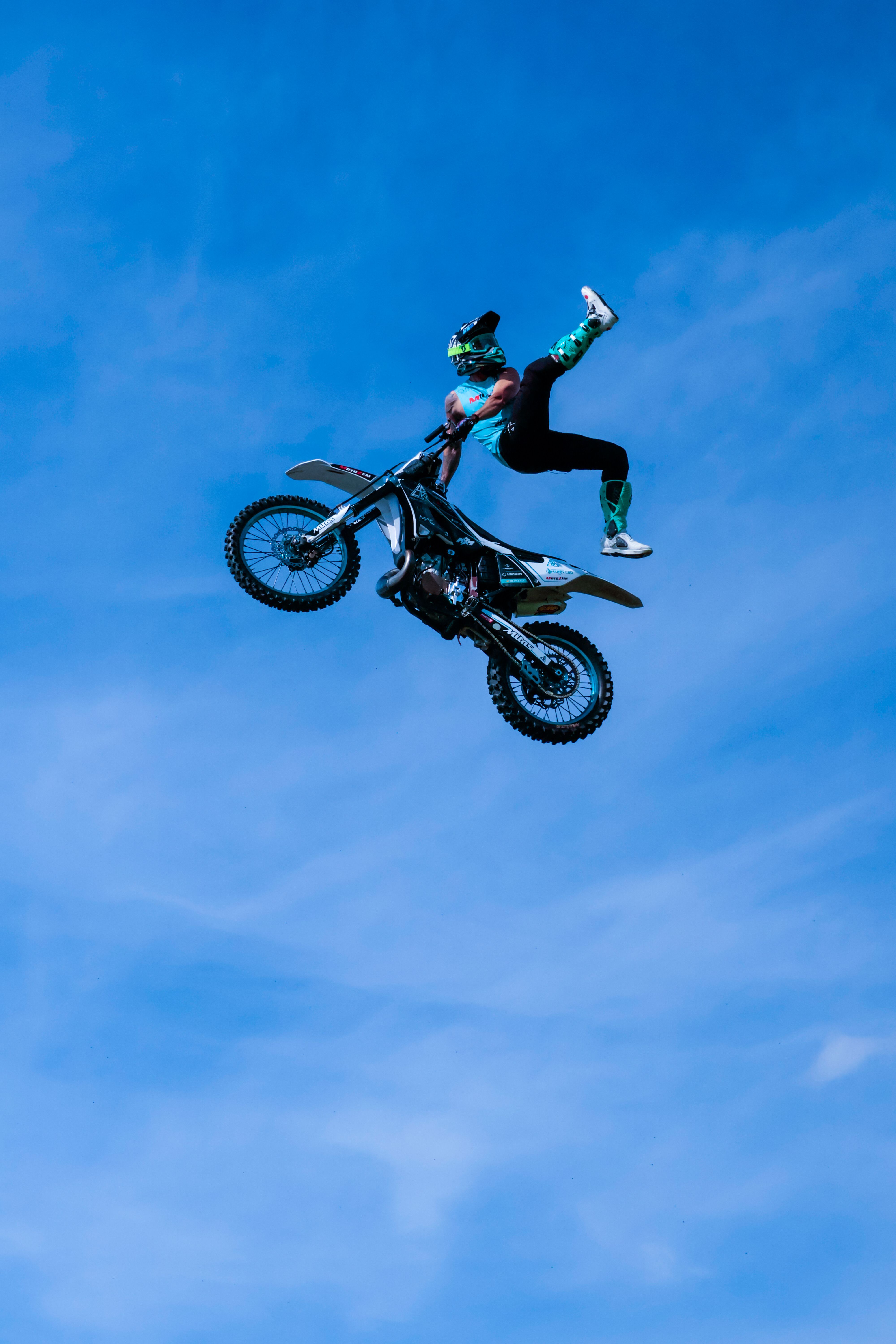 Photo of a Man Jumping a Motorbike Midair · Free Stock Photo