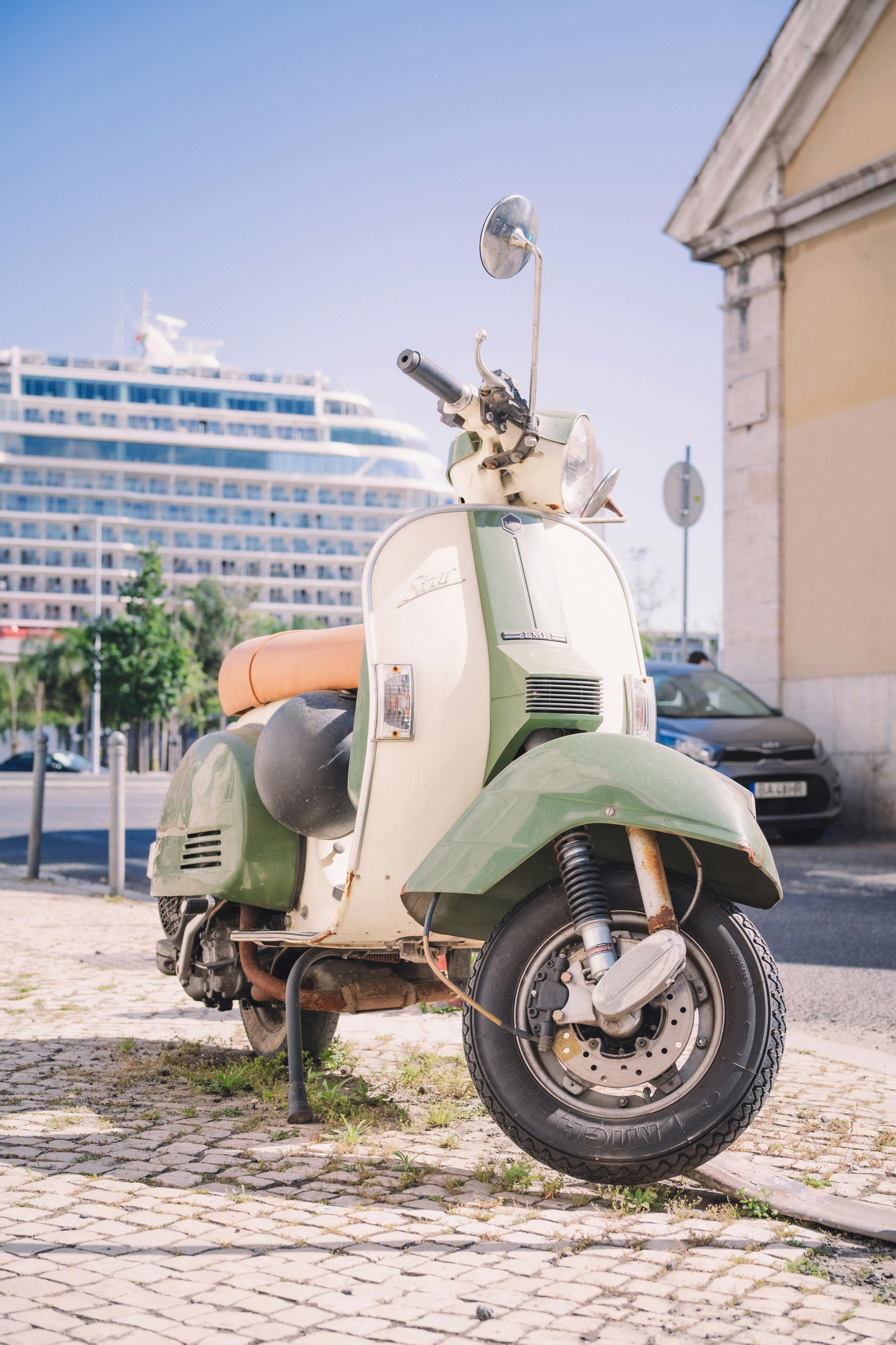 Parked Motor Scooter on Paving Stone · Free Stock Photo