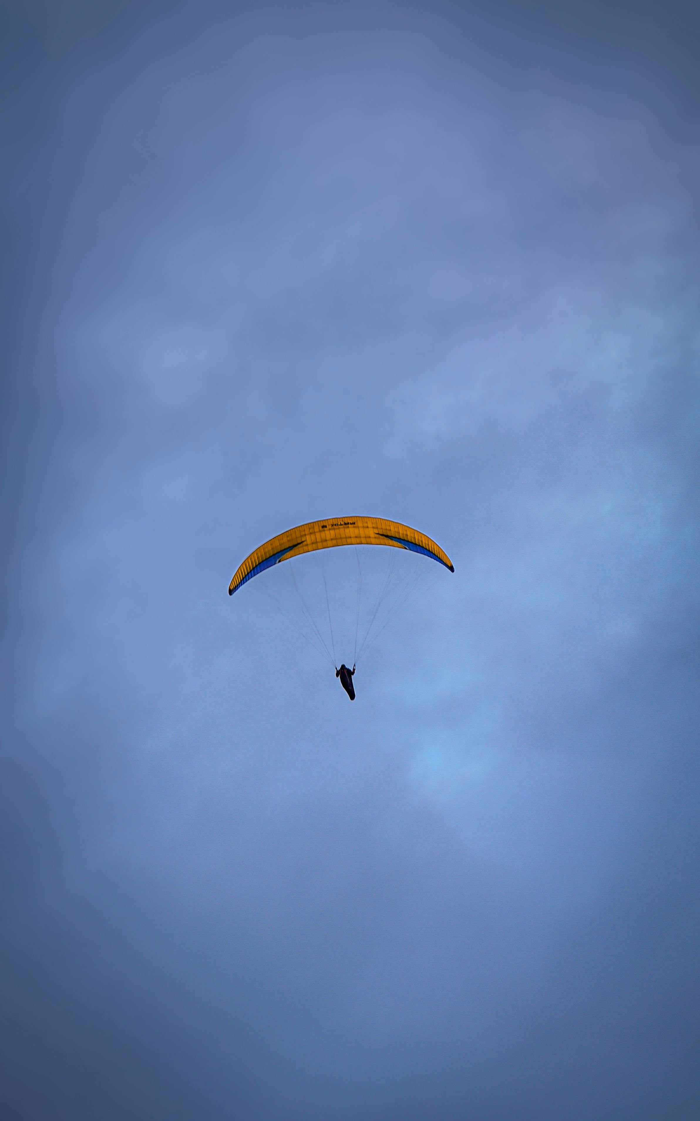 Blue Gliding Parachute · Free Stock Photo