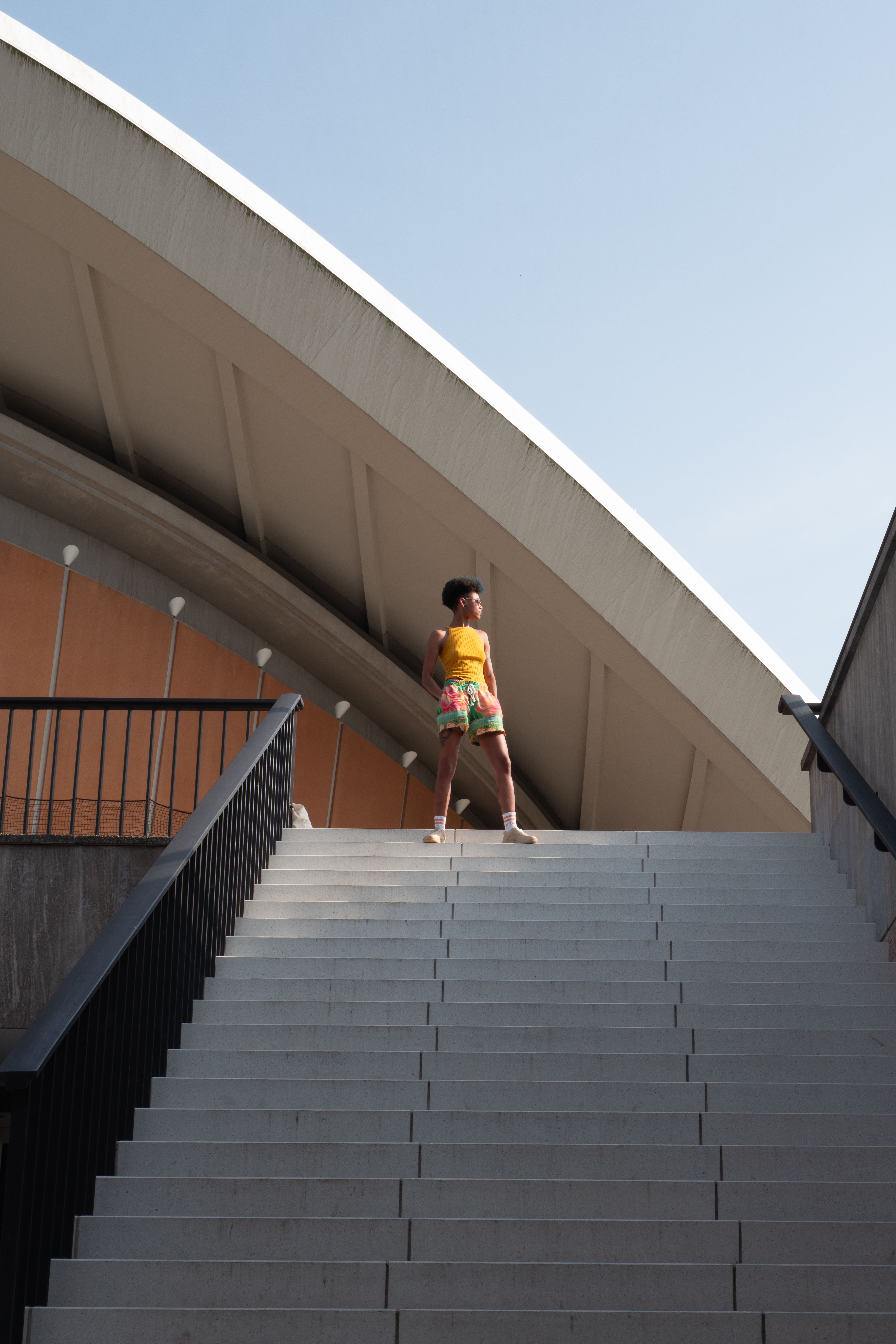 Woman Standing on Stairs · Free Stock Photo