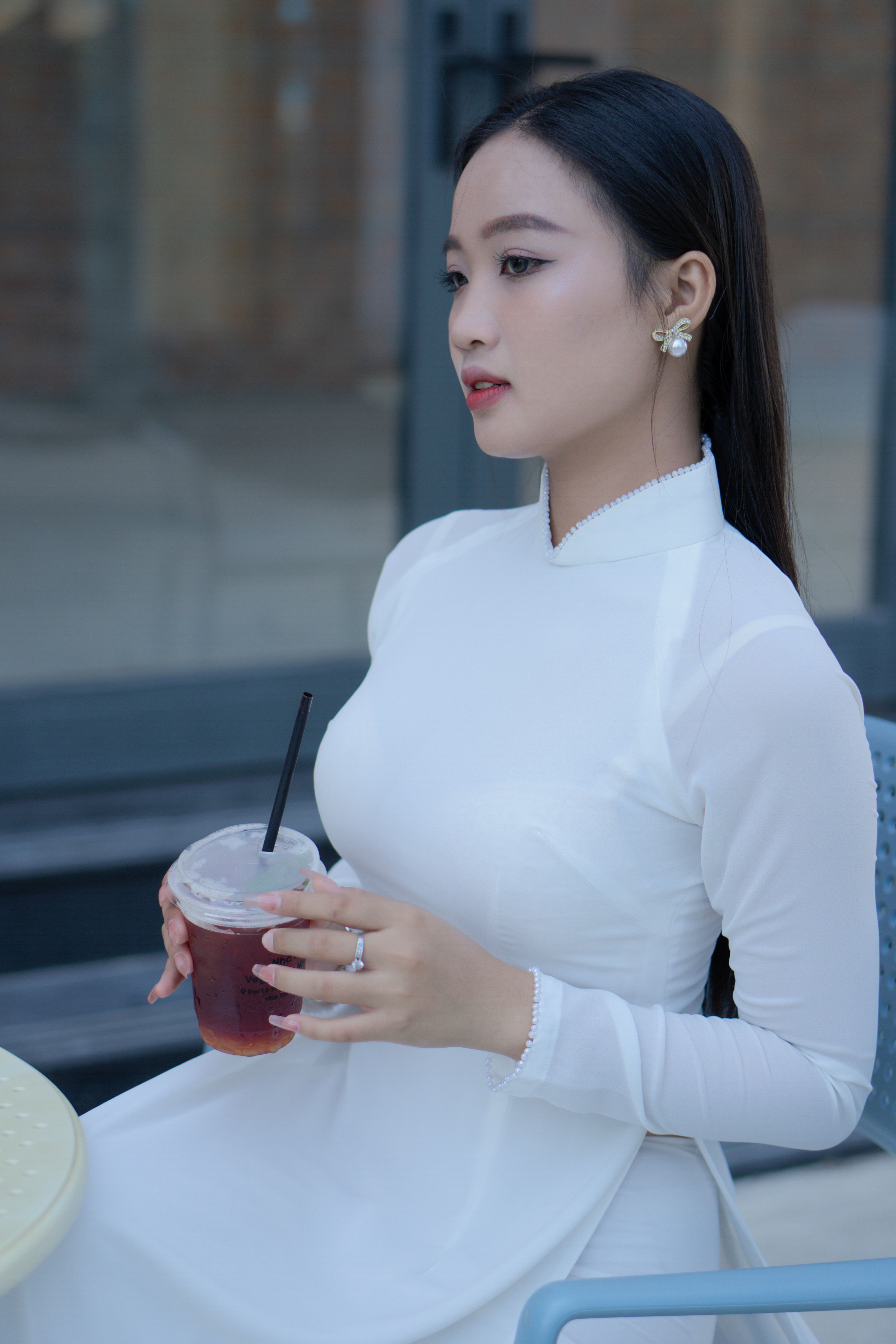 Portrait of Woman in Traditional Clothing and with Drink · Free Stock Photo