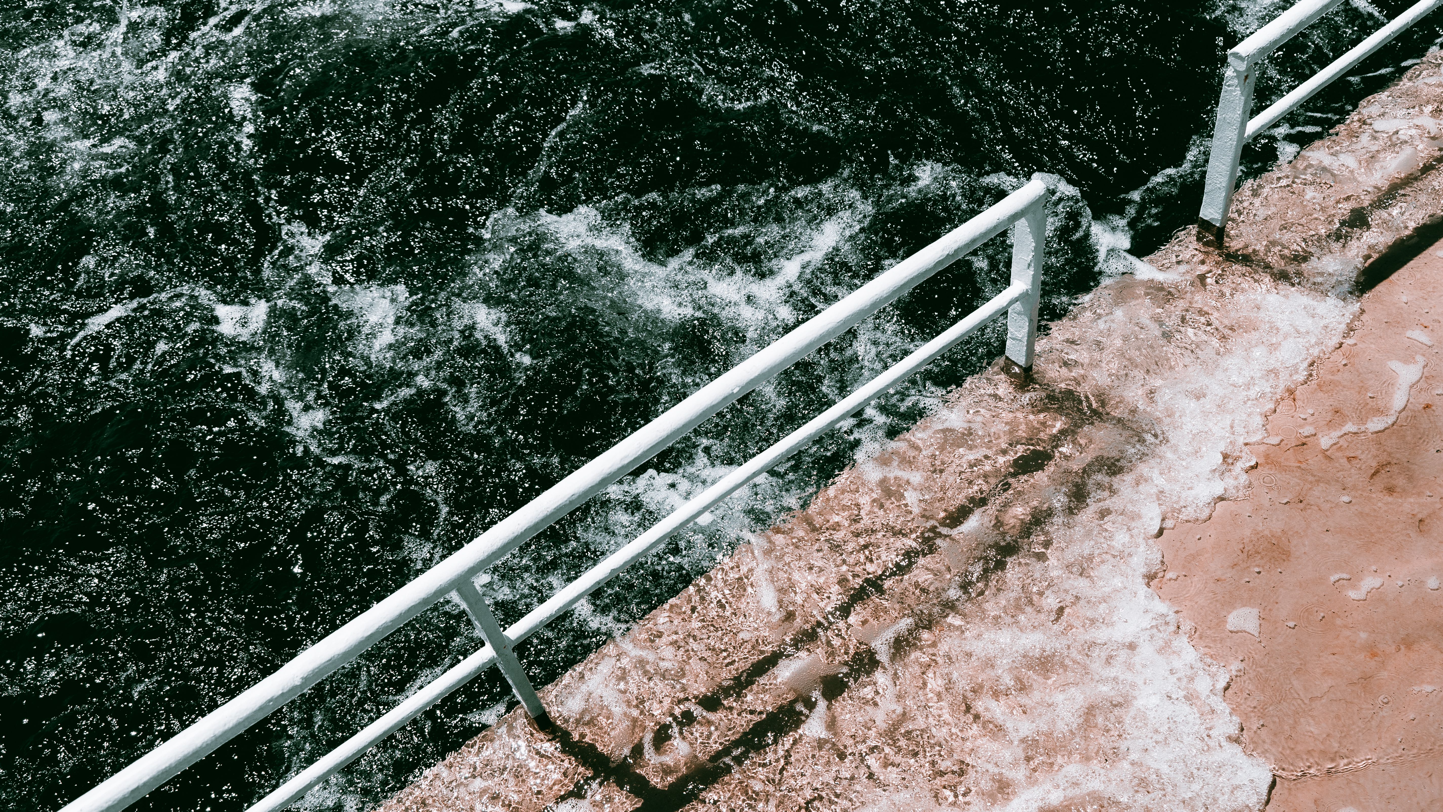 Wave over Railing and Promenade on Sea Shore · Free Stock Photo