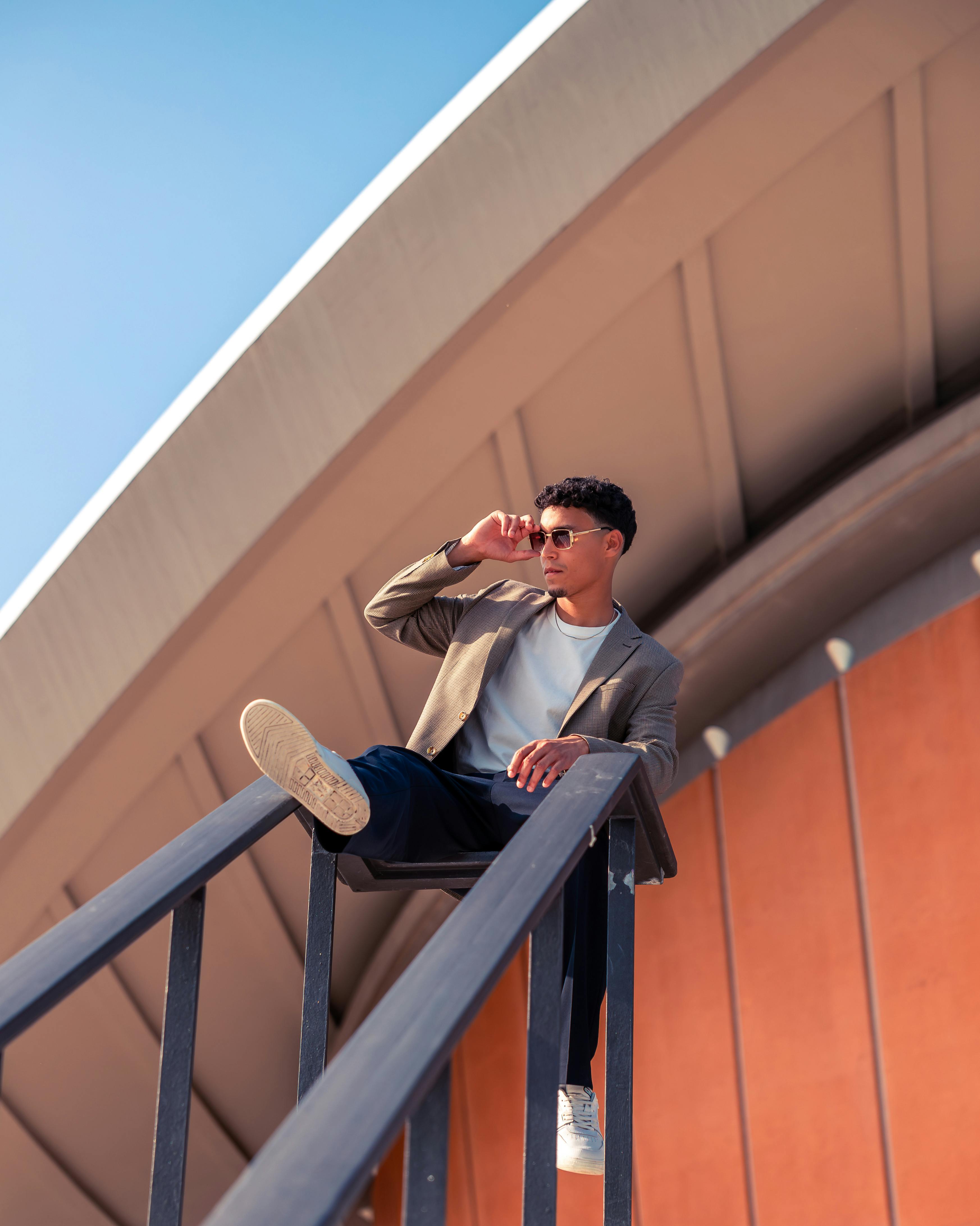 Young Man Sitting on the Railing in front of the Berlin Congress Hall ...