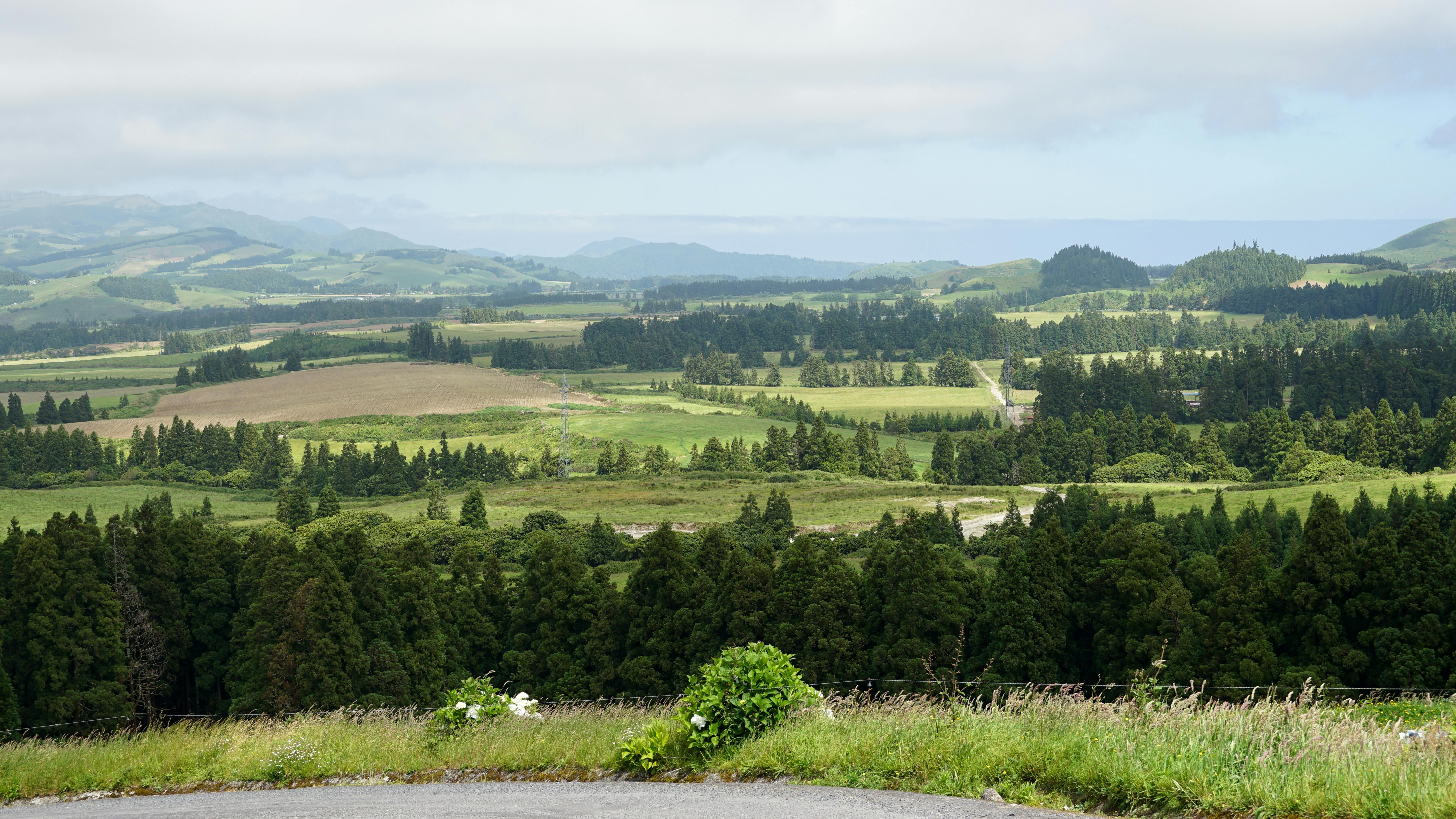 Scenic View of Green Fields and Hills in the Countryside · Free Stock Photo