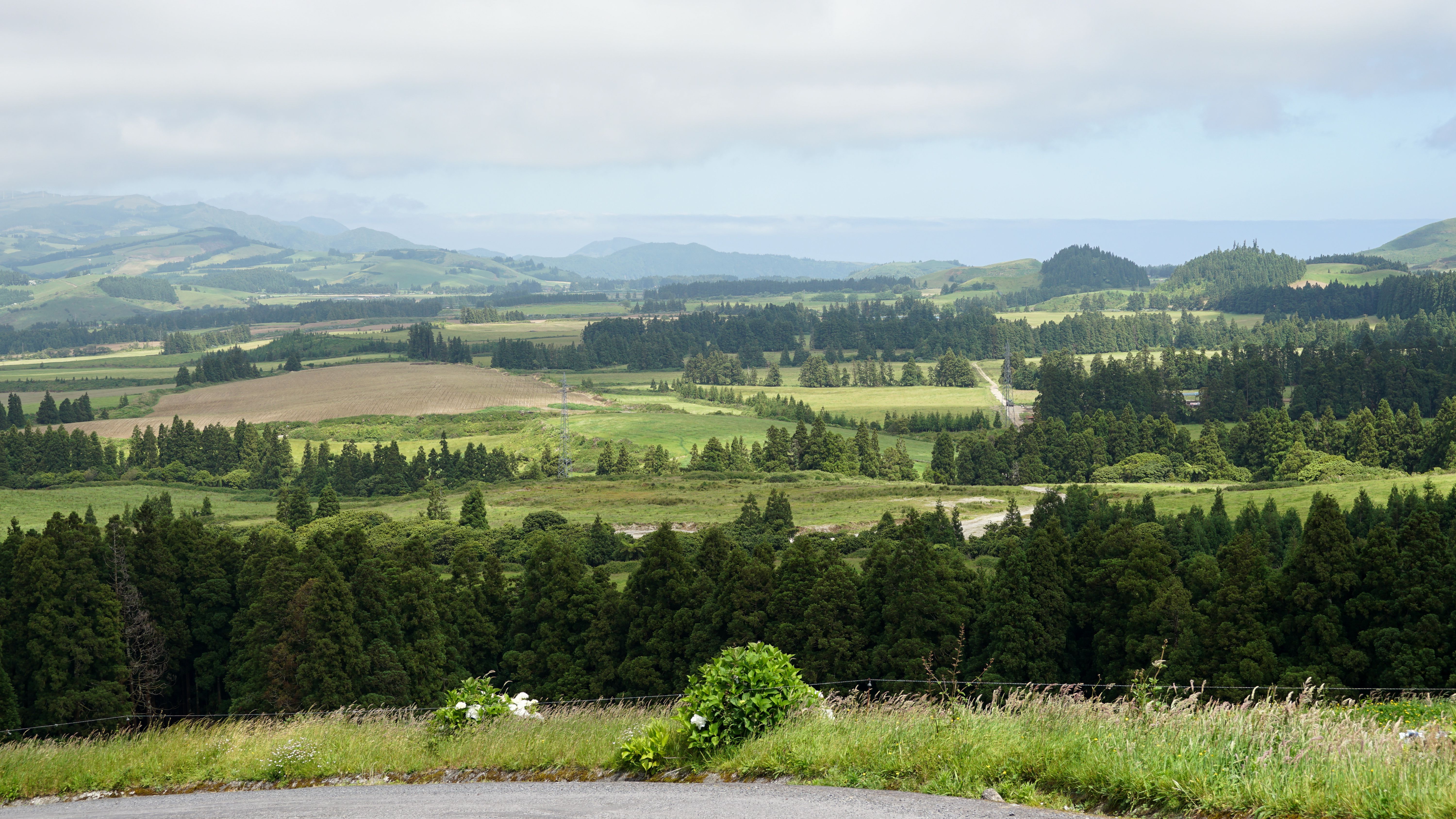 Scenic View of Green Fields and Hills in the Countryside · Free Stock Photo