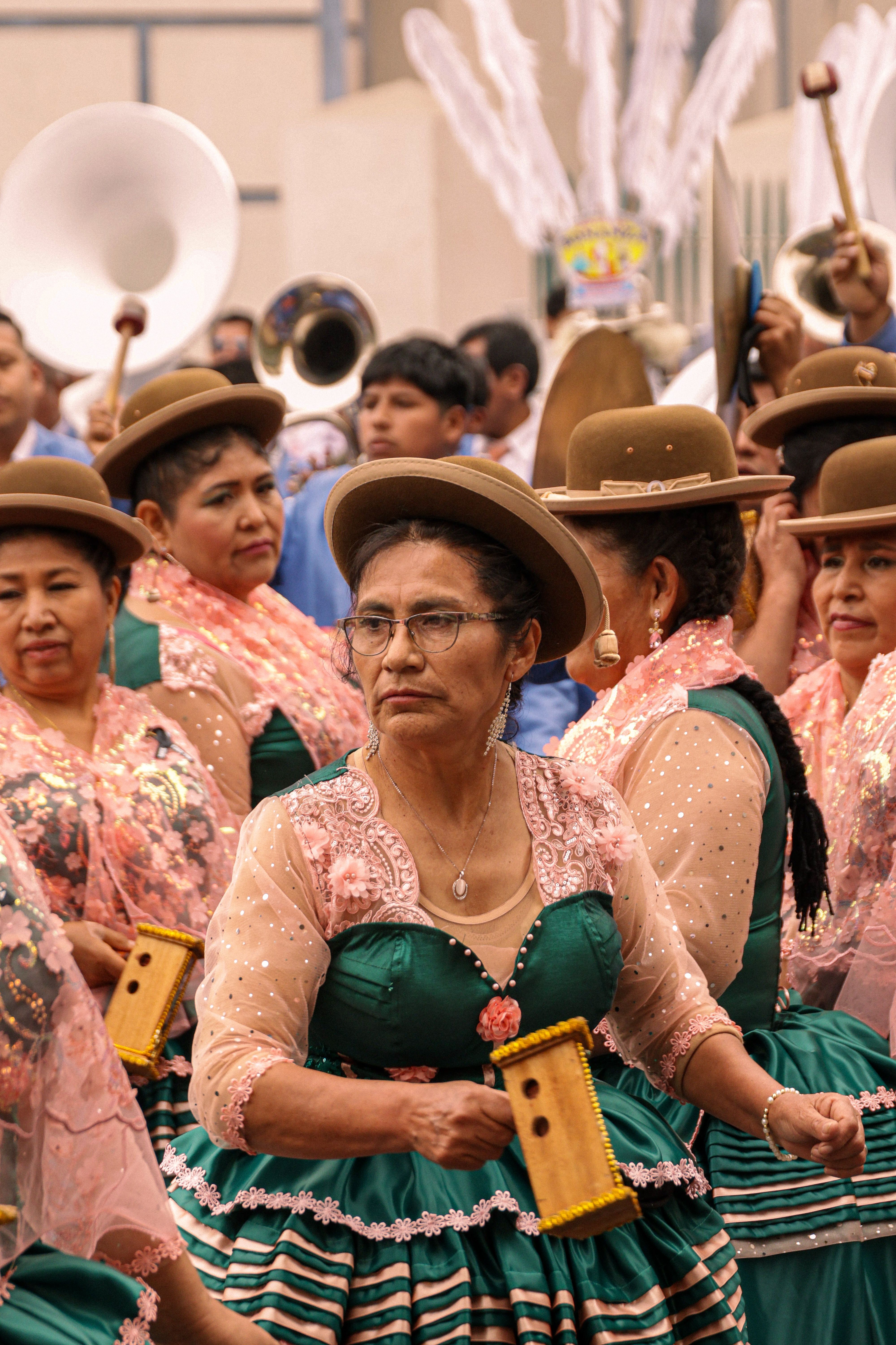 Women in traditional dress and hats are playing instruments · Free ...