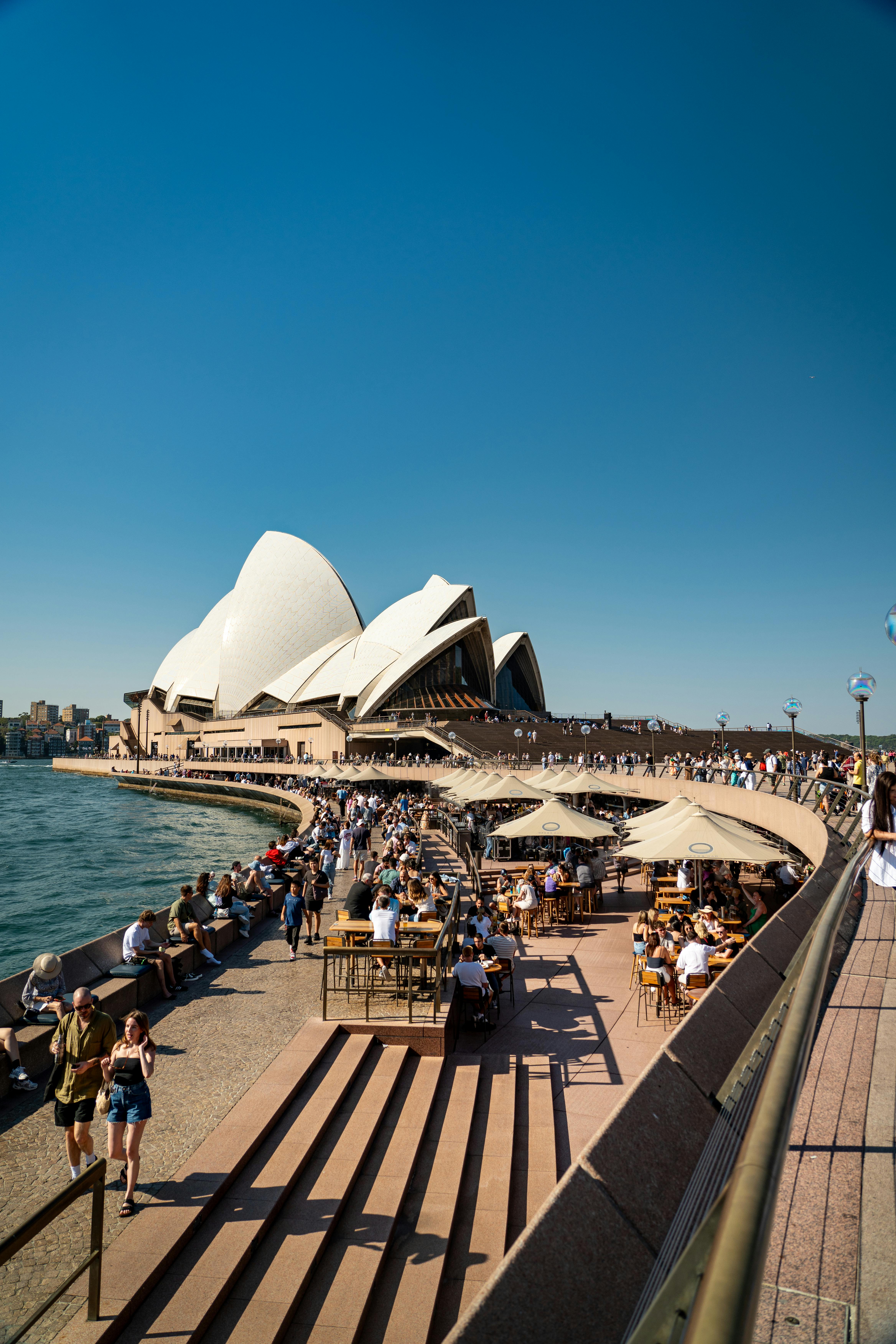 People Relaxing in front of the Sydney Opera House · Free Stock Photo