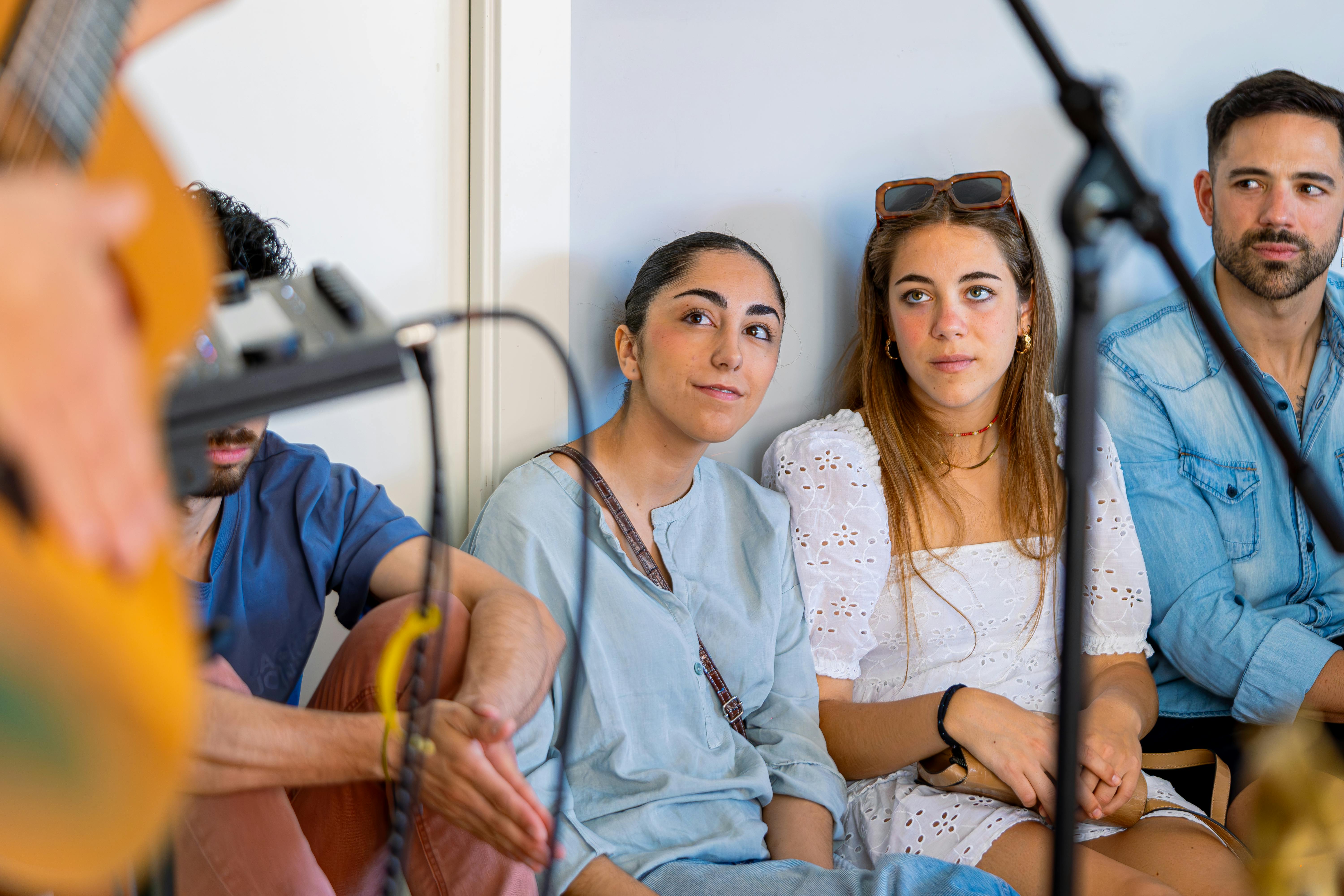Audience at the Concert Staring at the Musician · Free Stock Photo