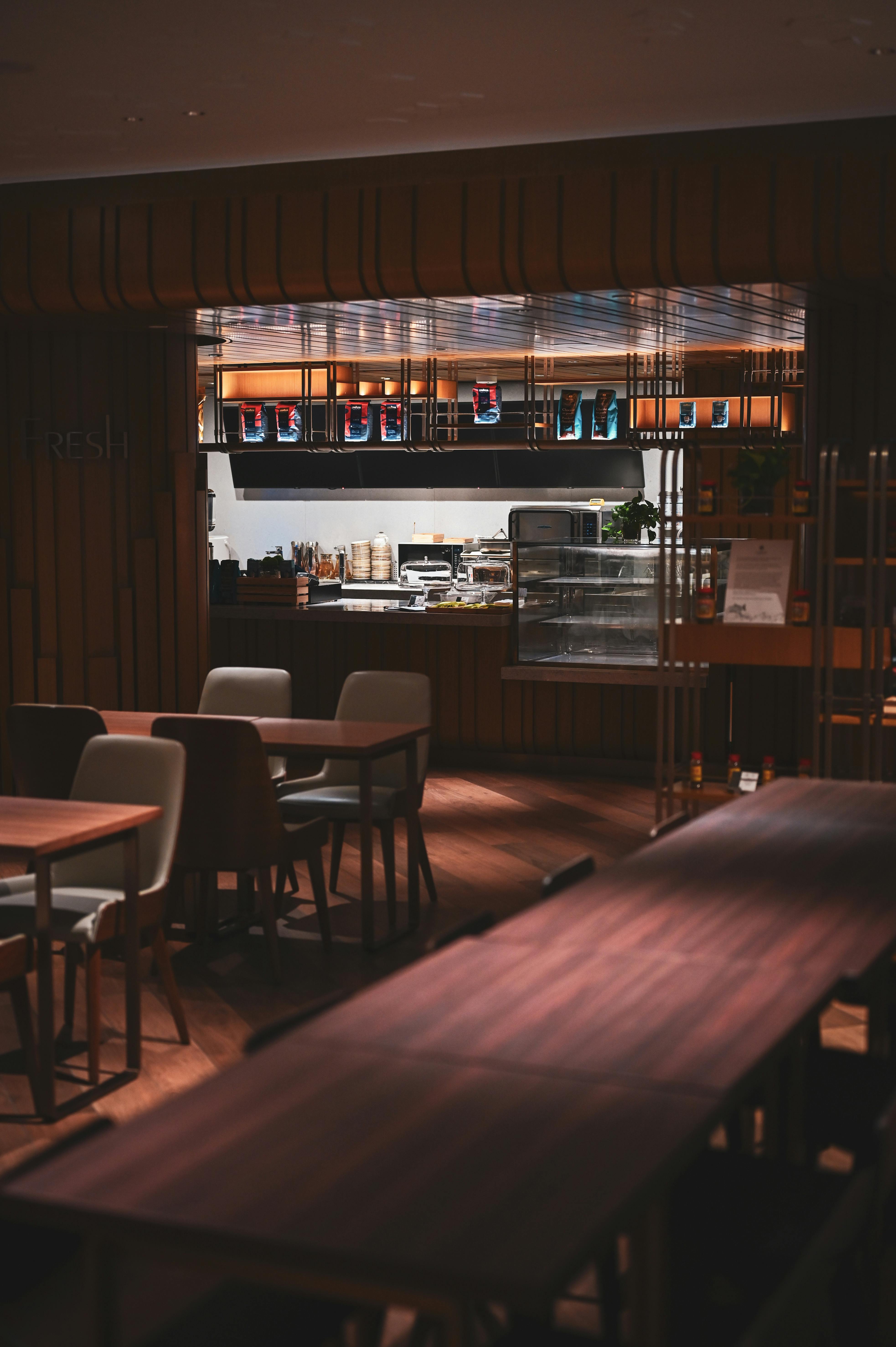 Empty Dark Cafe with Wooden Chairs and Tables · Free Stock Photo