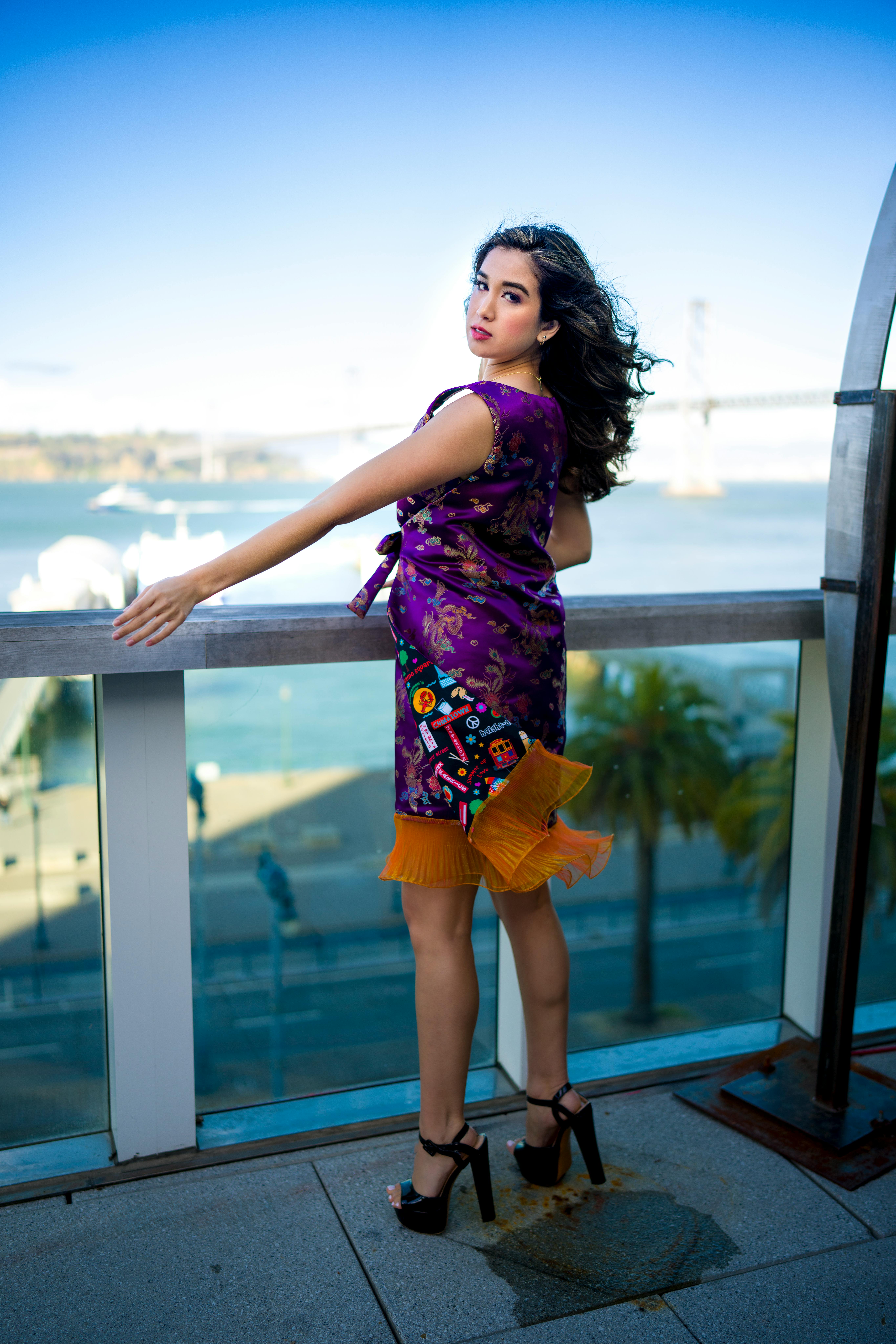 Woman Wearing Purple Dress on Balcony · Free Stock Photo