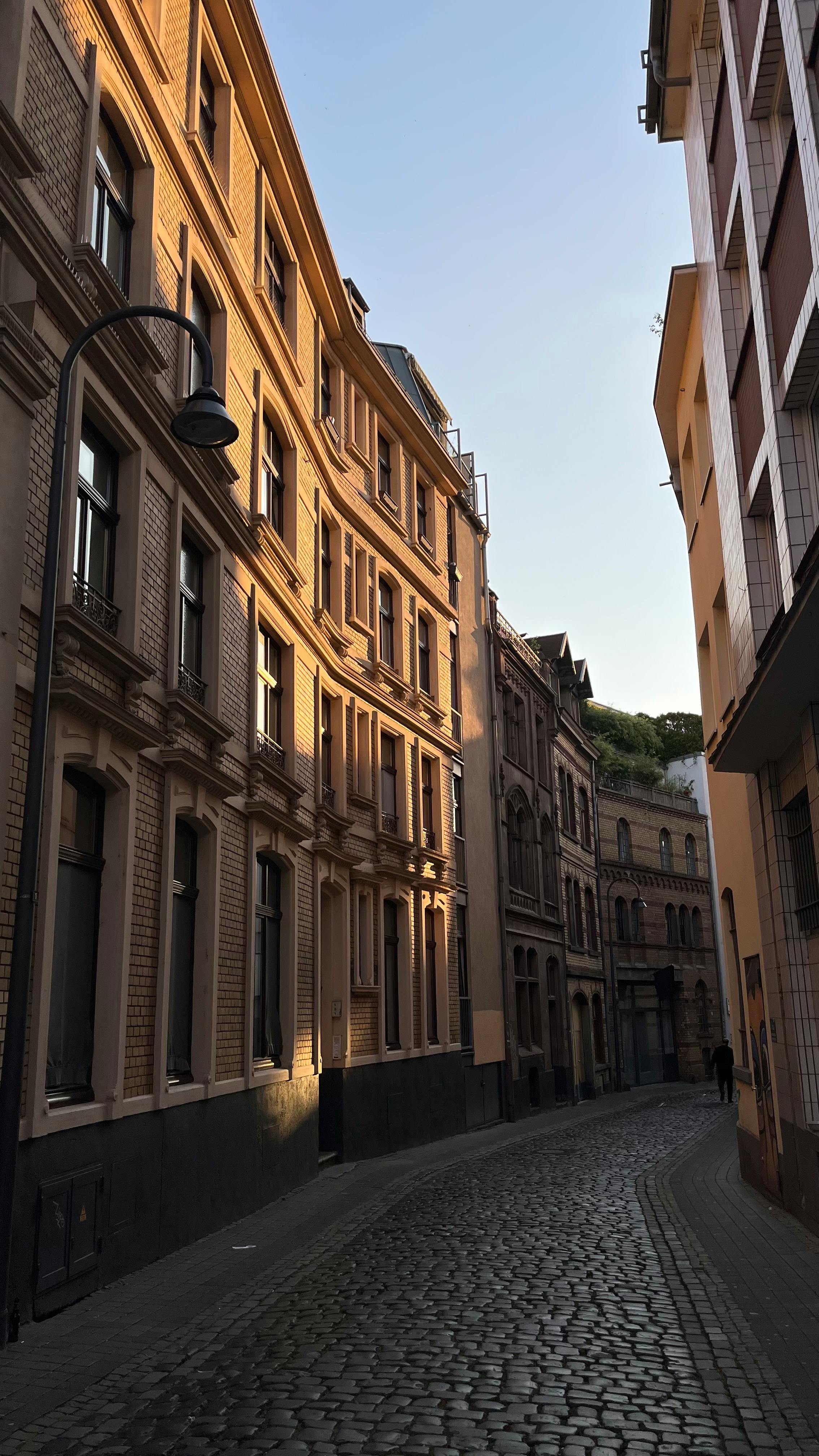Tenements in a Narrow Alley During Sunset · Free Stock Photo