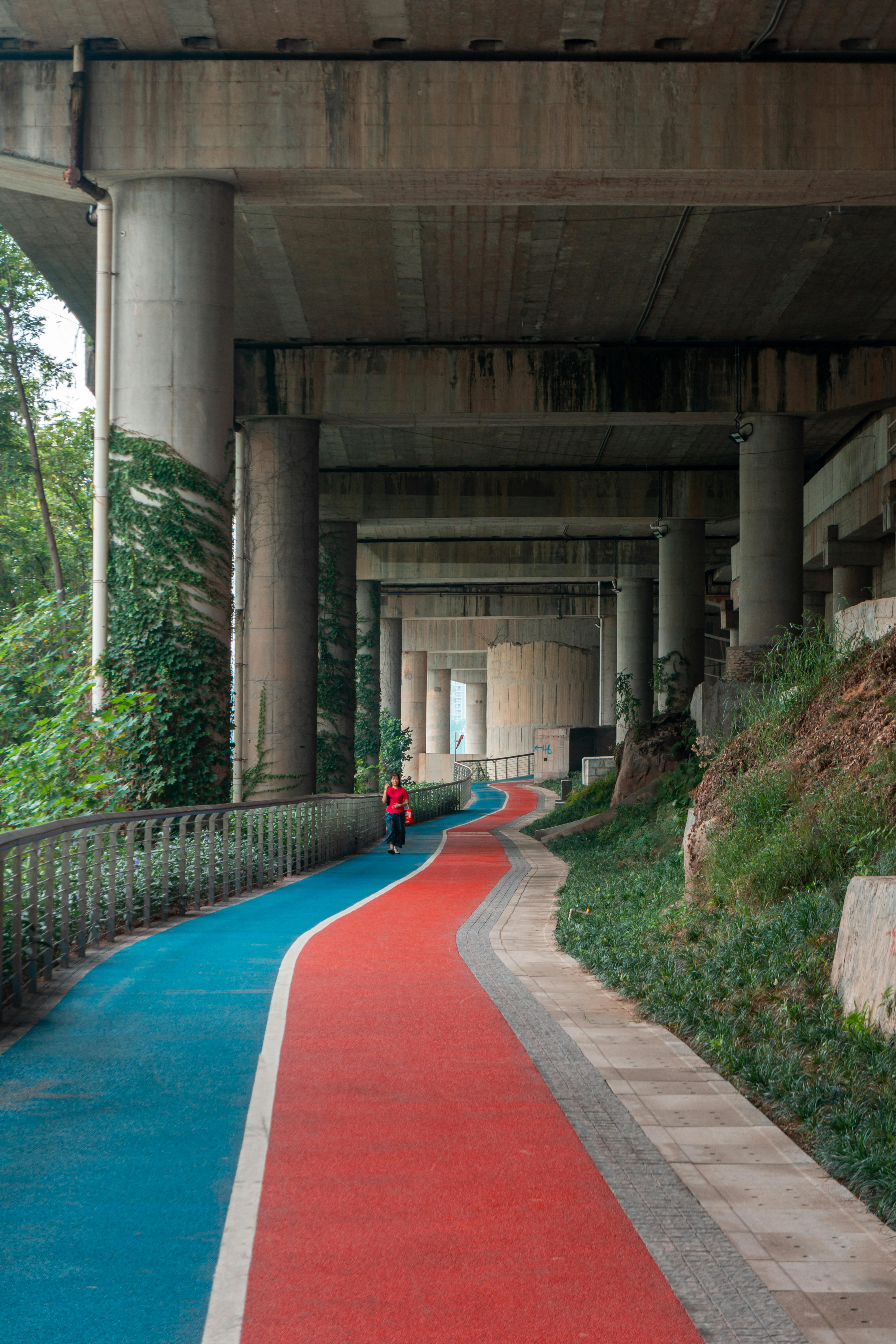 A Pedestrian Walkway under a Bridge · Free Stock Photo