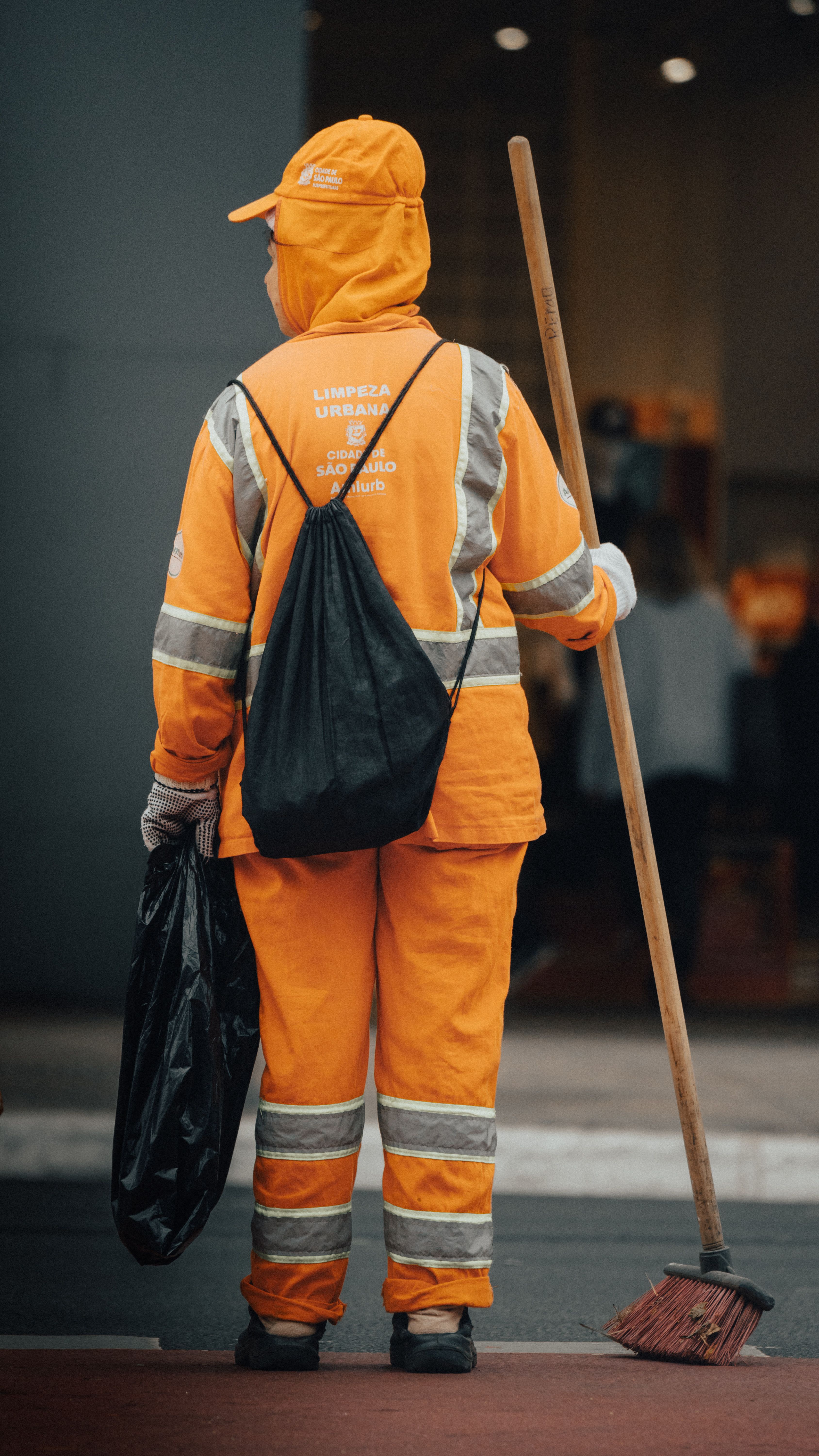 Back View of a Street Cleaner in a Uniform Standing on the Sidewalk ...