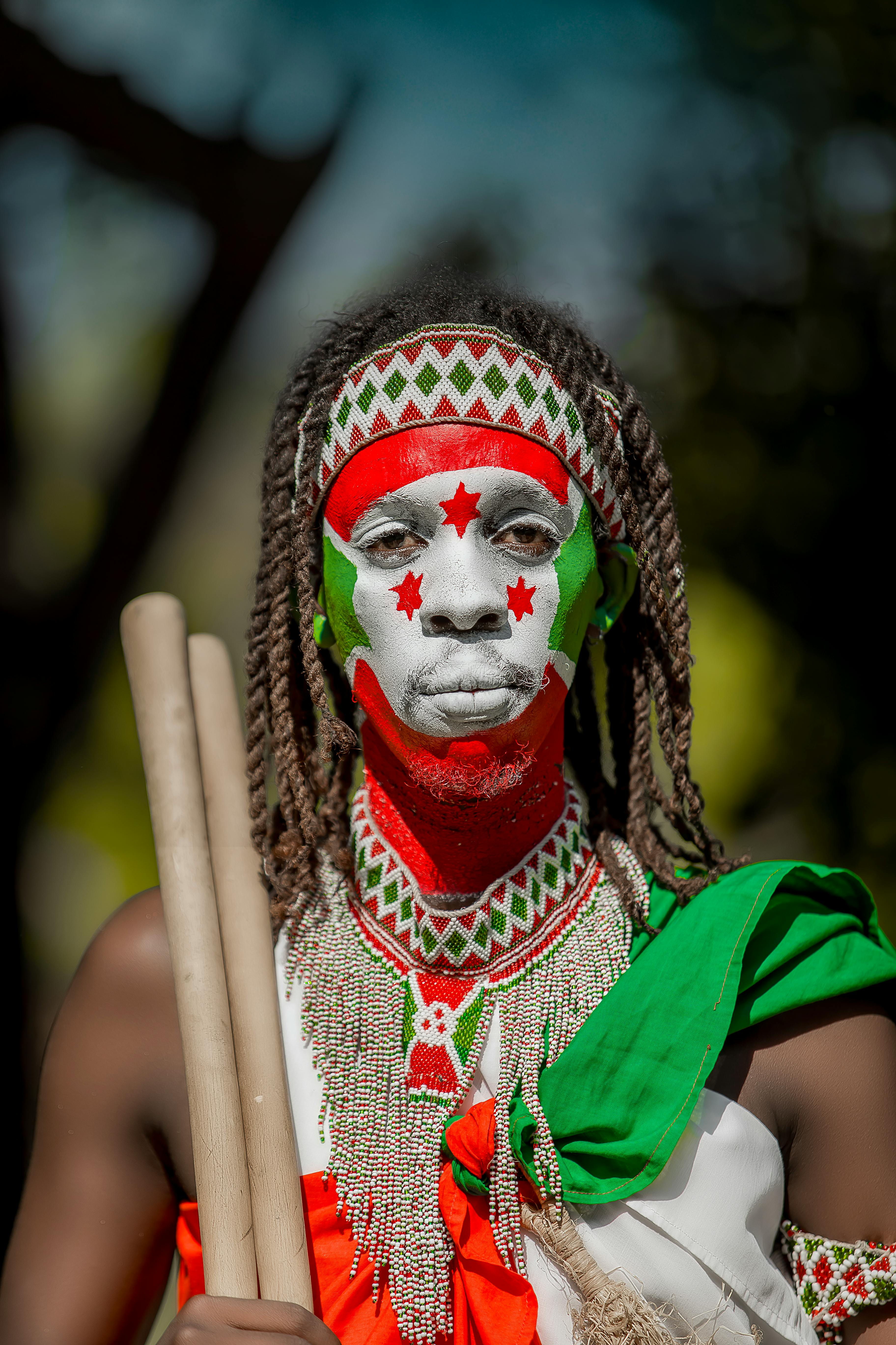 Traditional Performer with Face Paint and Cultural Attire · Free Stock ...