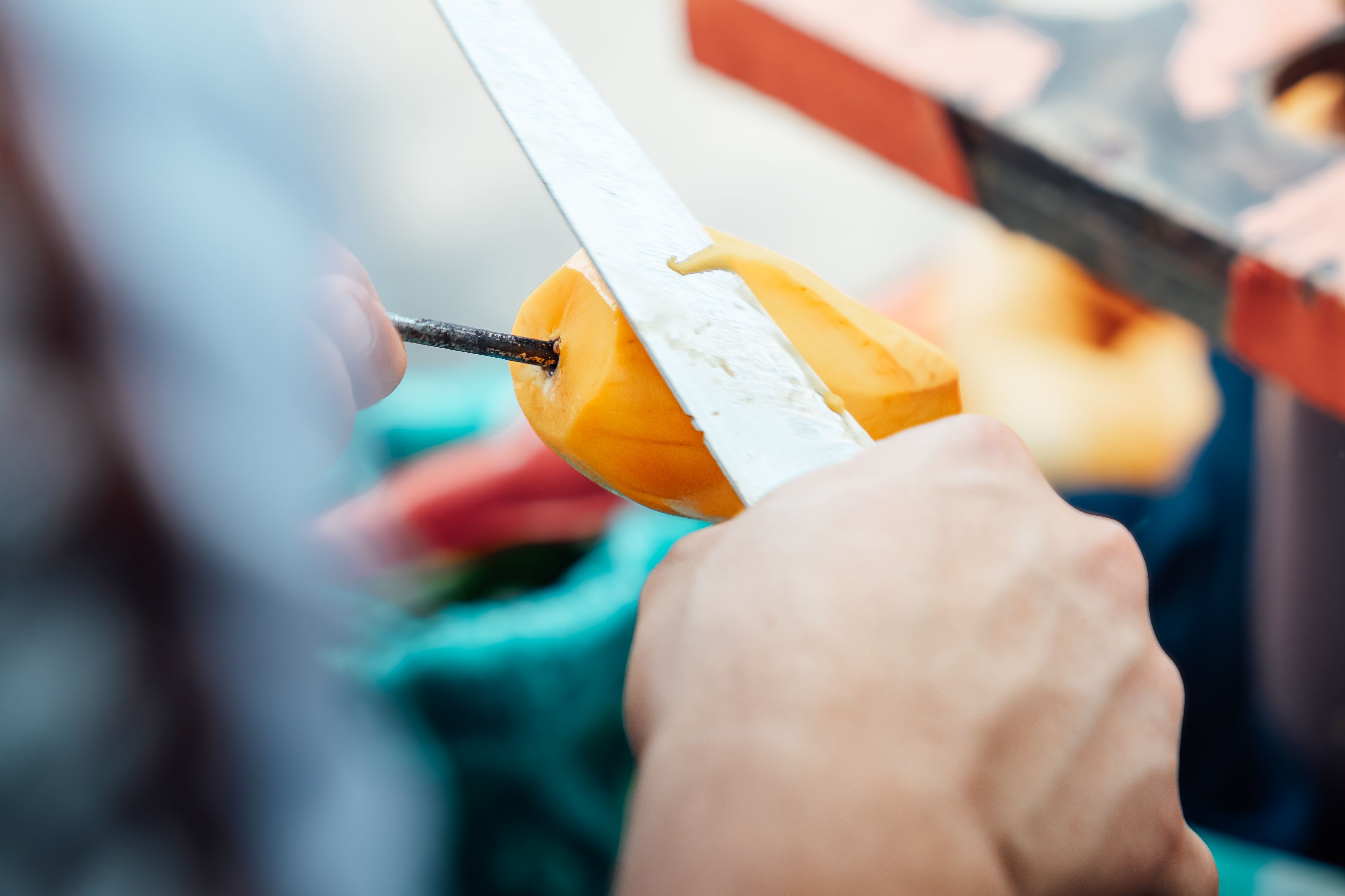 Hand Cutting a Fruit with a Knife · Free Stock Photo