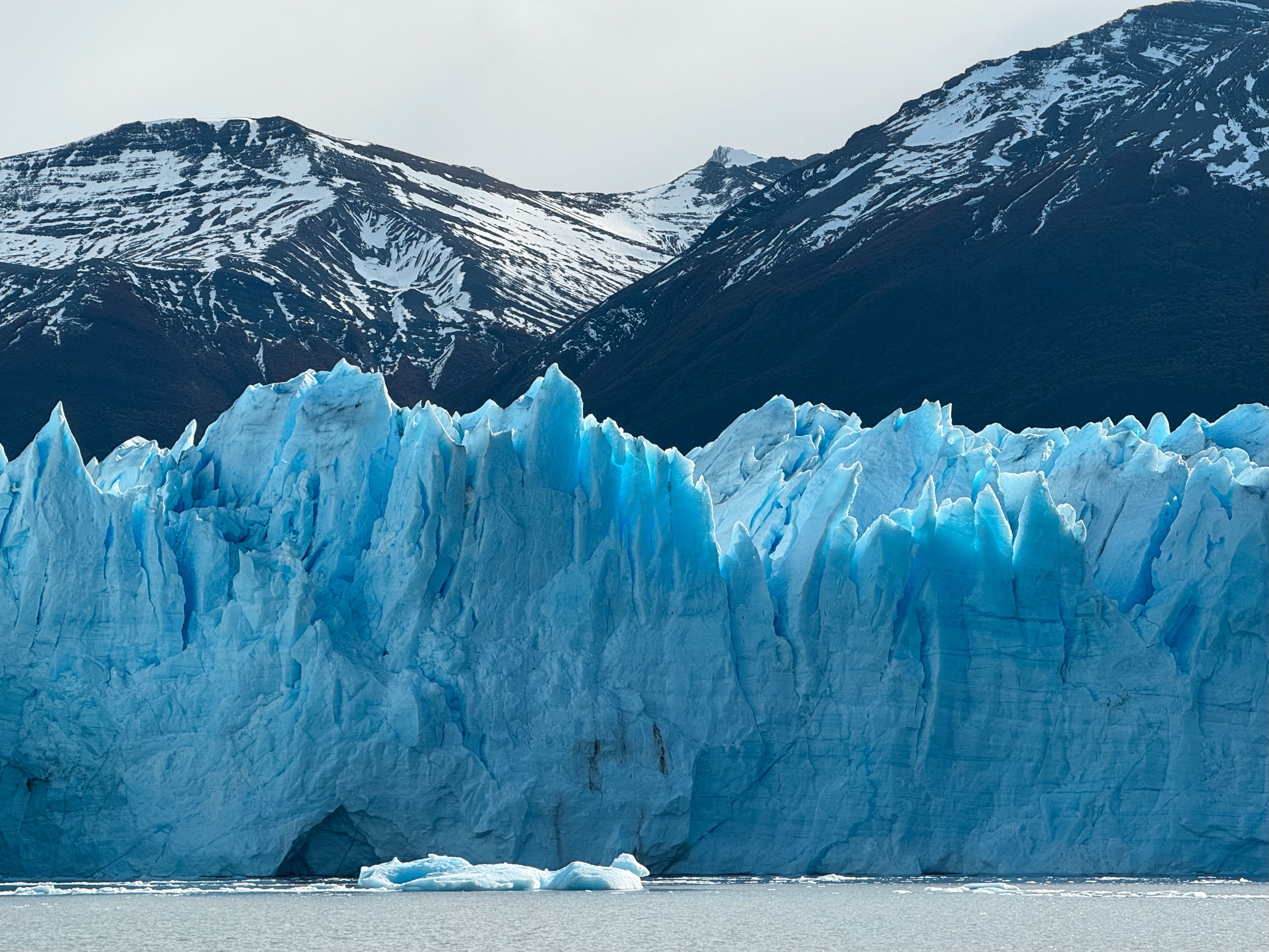 Melting Glacier Against Mountain Landscape · Free Stock Photo