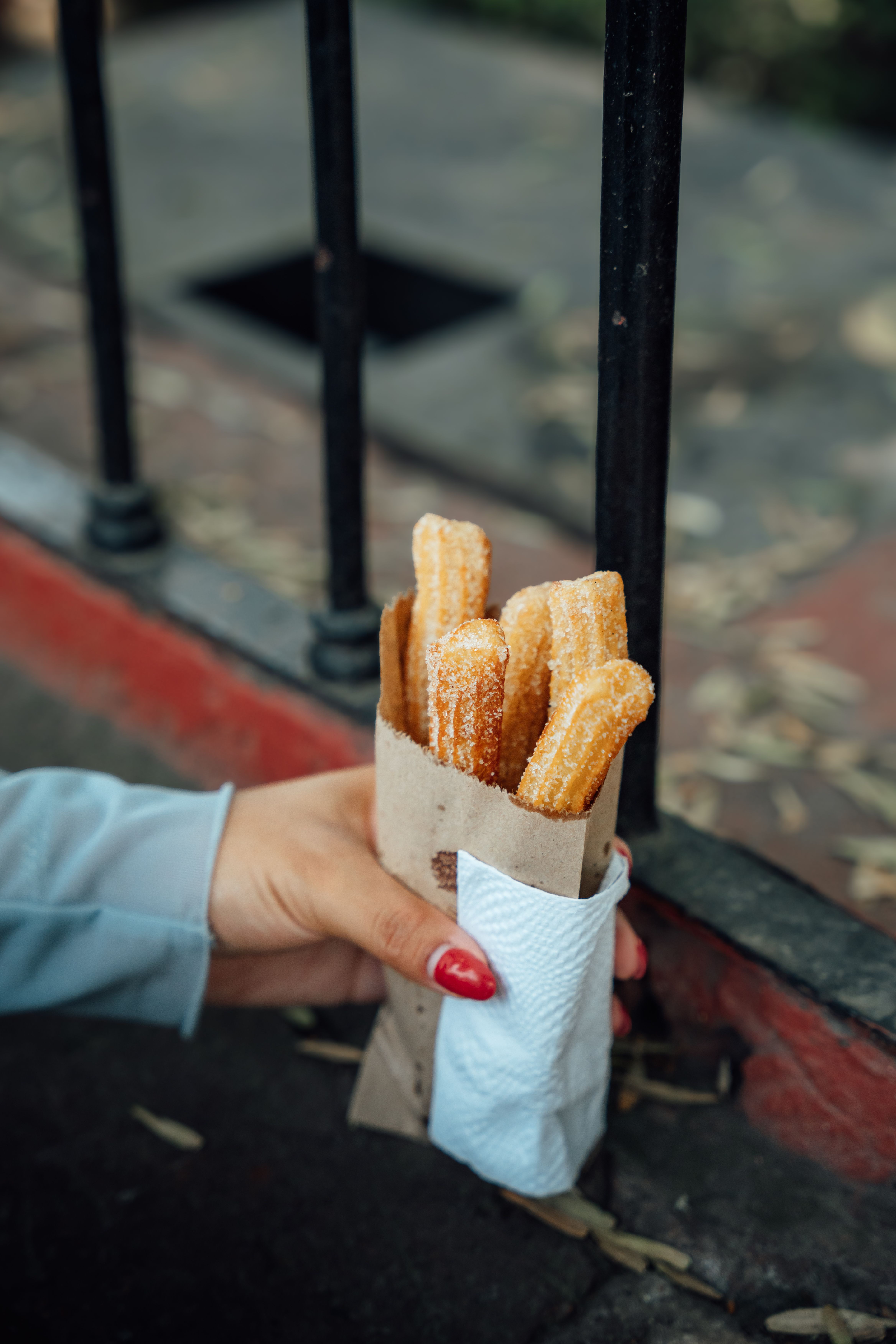 Woman Hand Holding Churros · Free Stock Photo