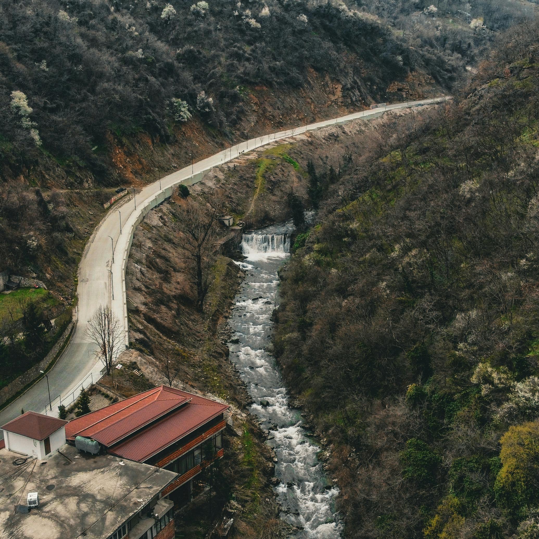 River and Road in Village in Valley · Free Stock Photo