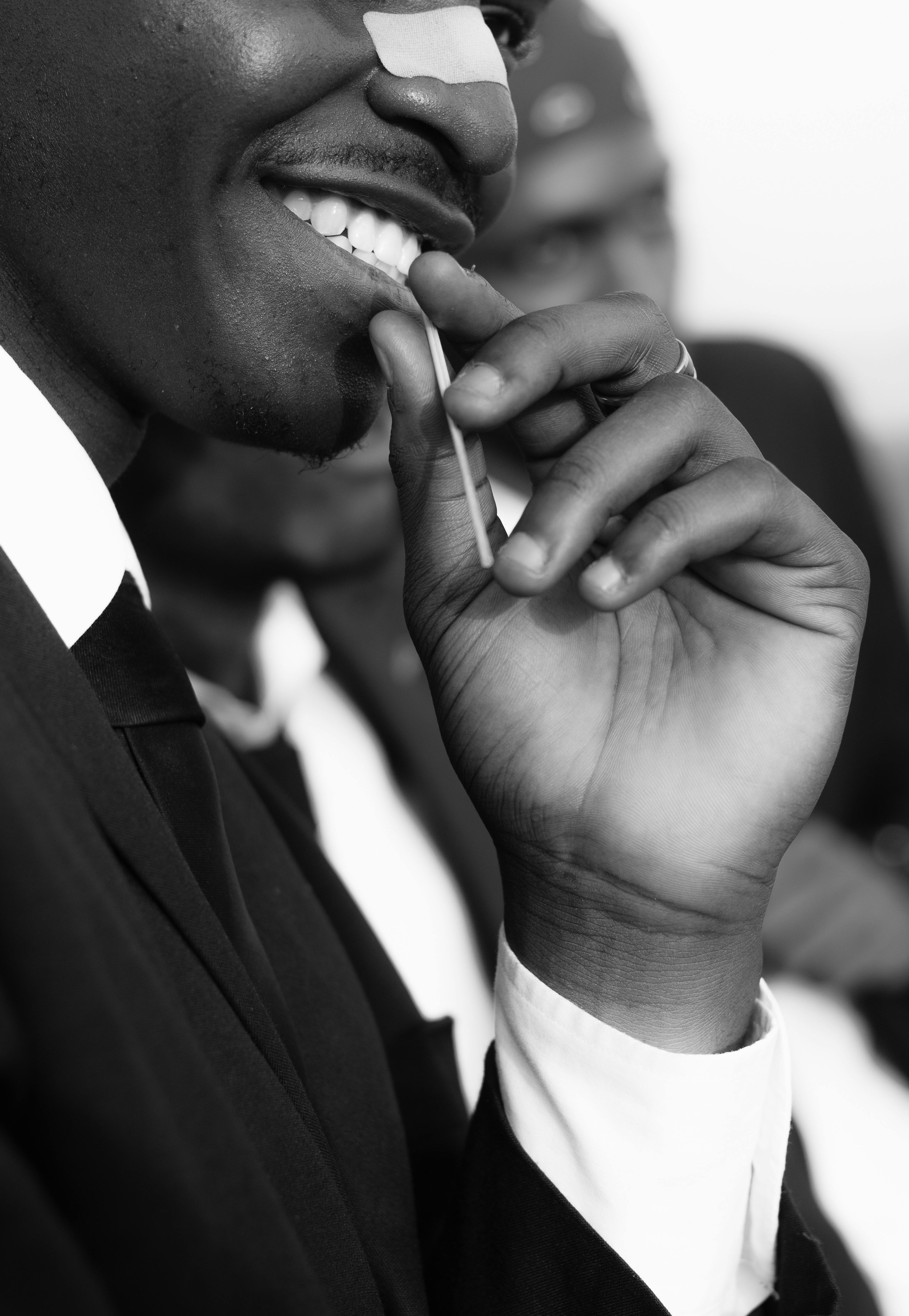 Elegant Man with Toothpick in Mouth · Free Stock Photo