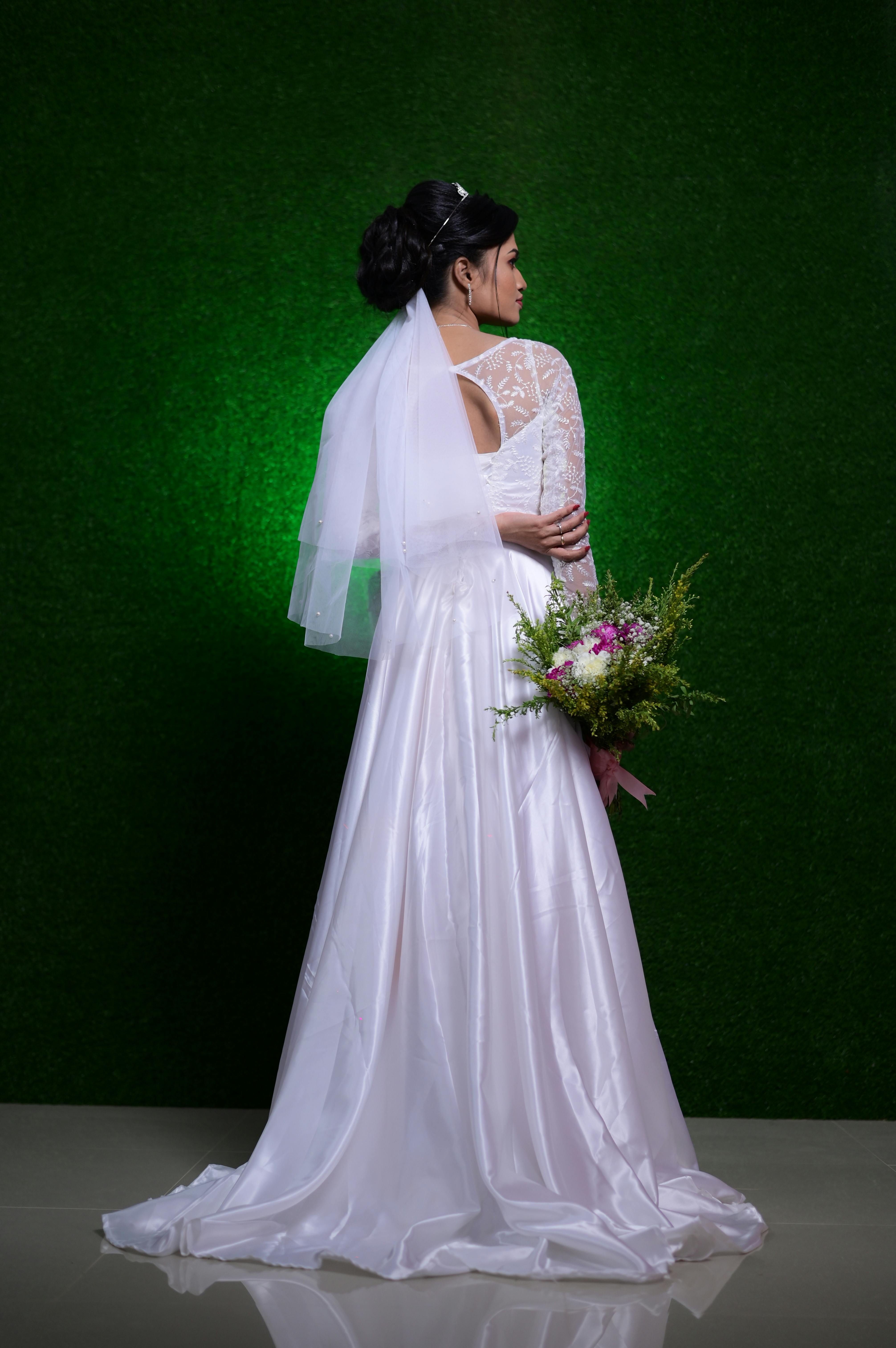 Standing Bride Holding Bouquet · Free Stock Photo