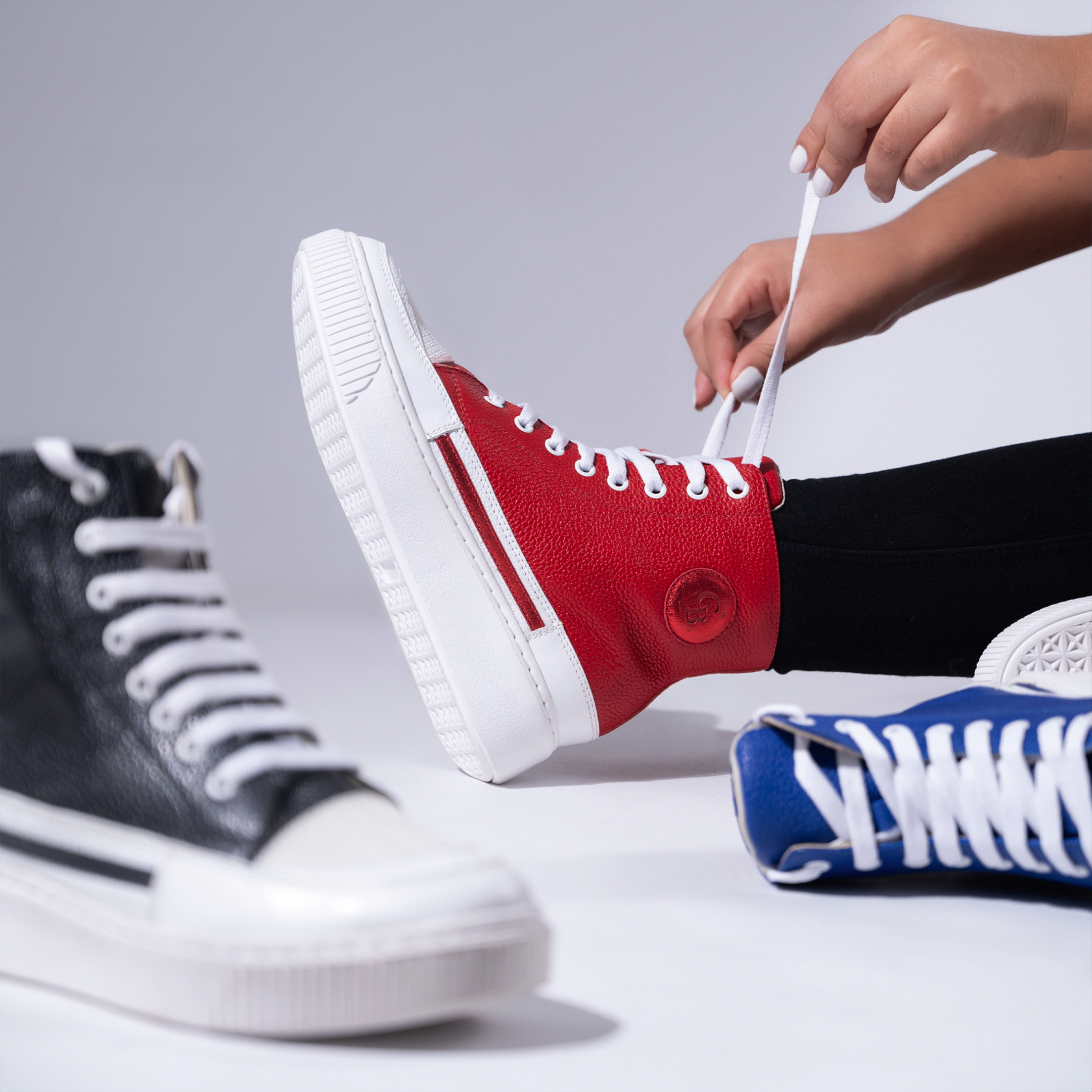 Woman Hands Tying Shoes · Free Stock Photo