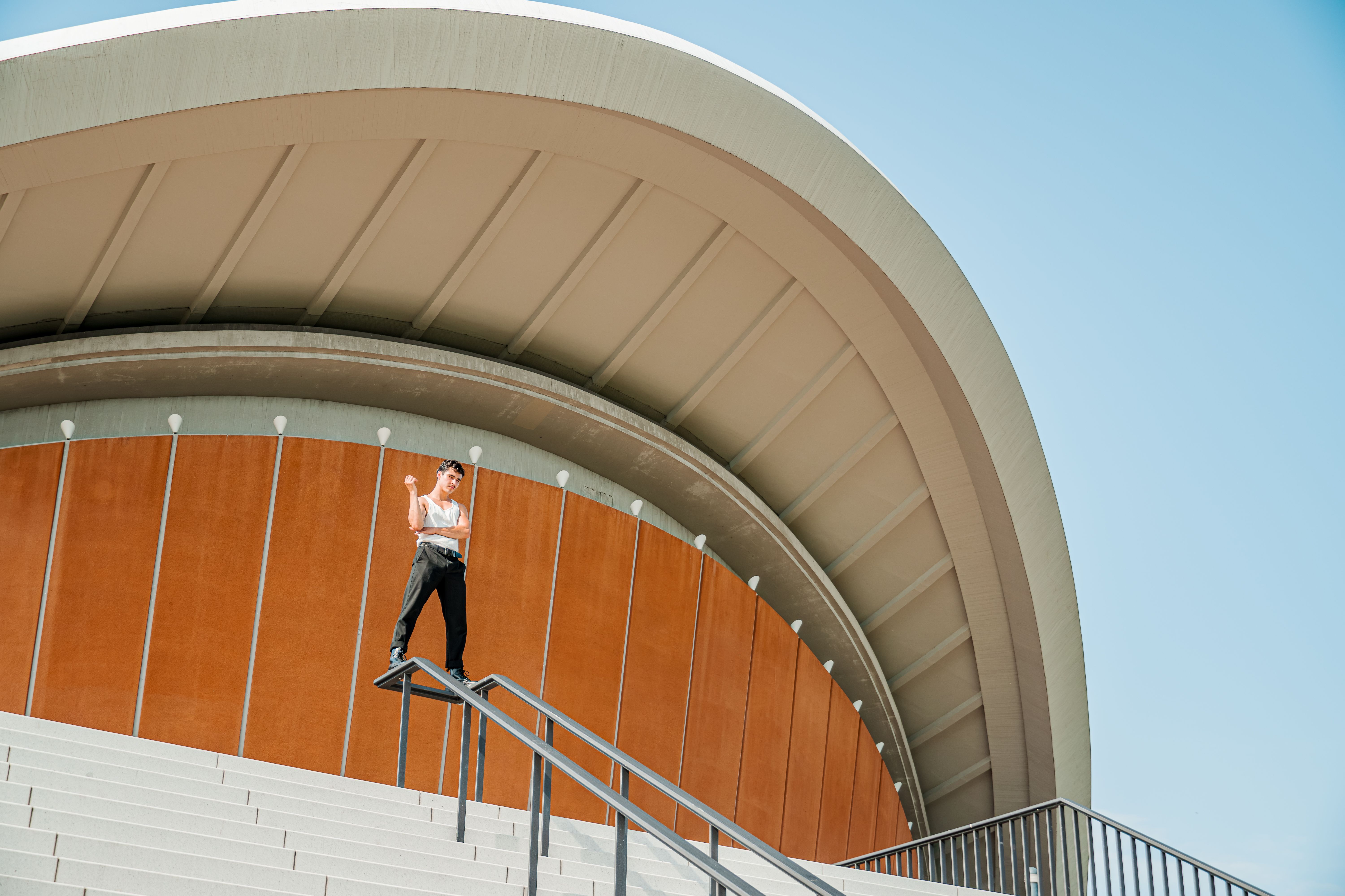 A person on a skateboard doing a trick on a rail · Free Stock Photo