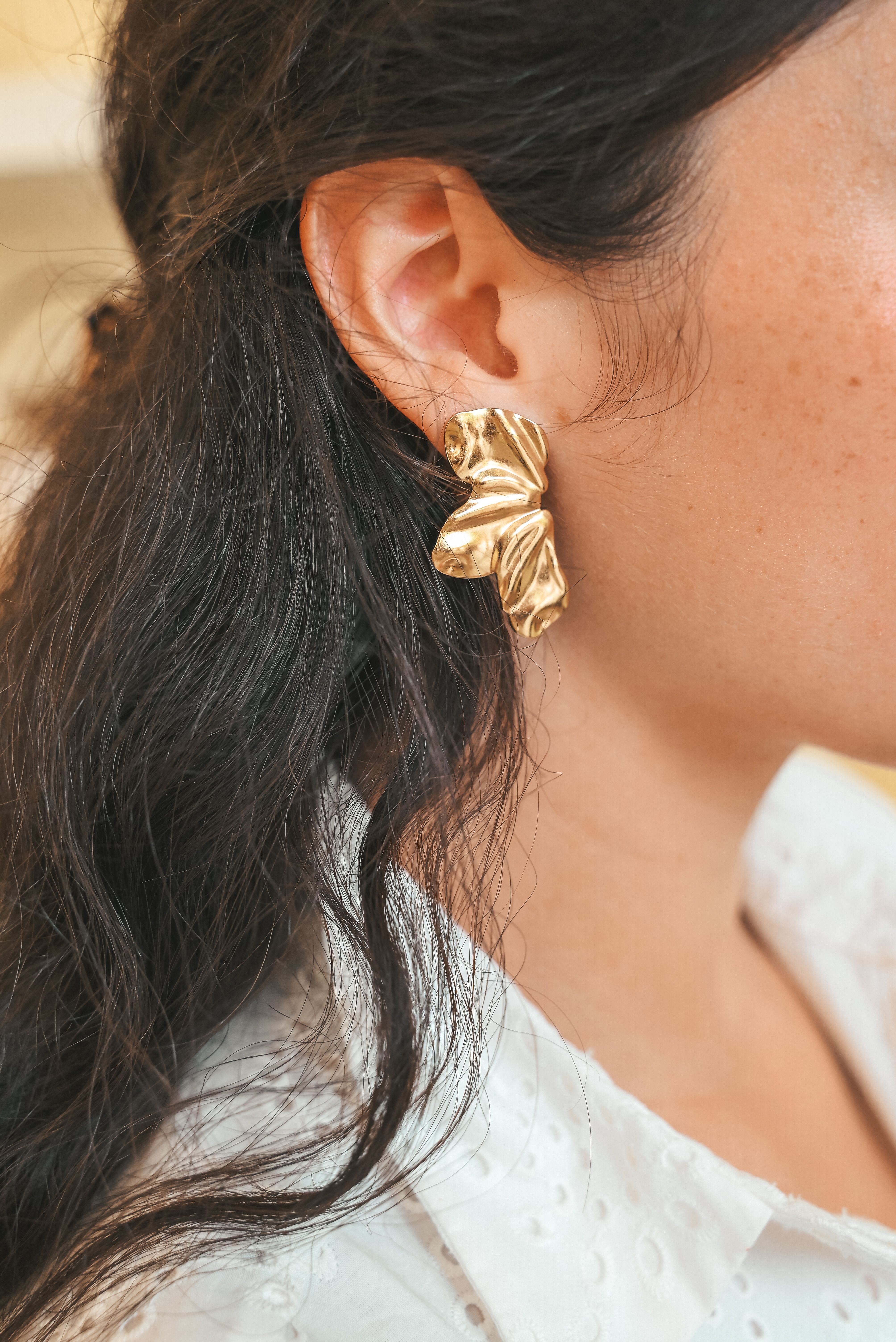 Golden Earring of Brunette Woman · Free Stock Photo