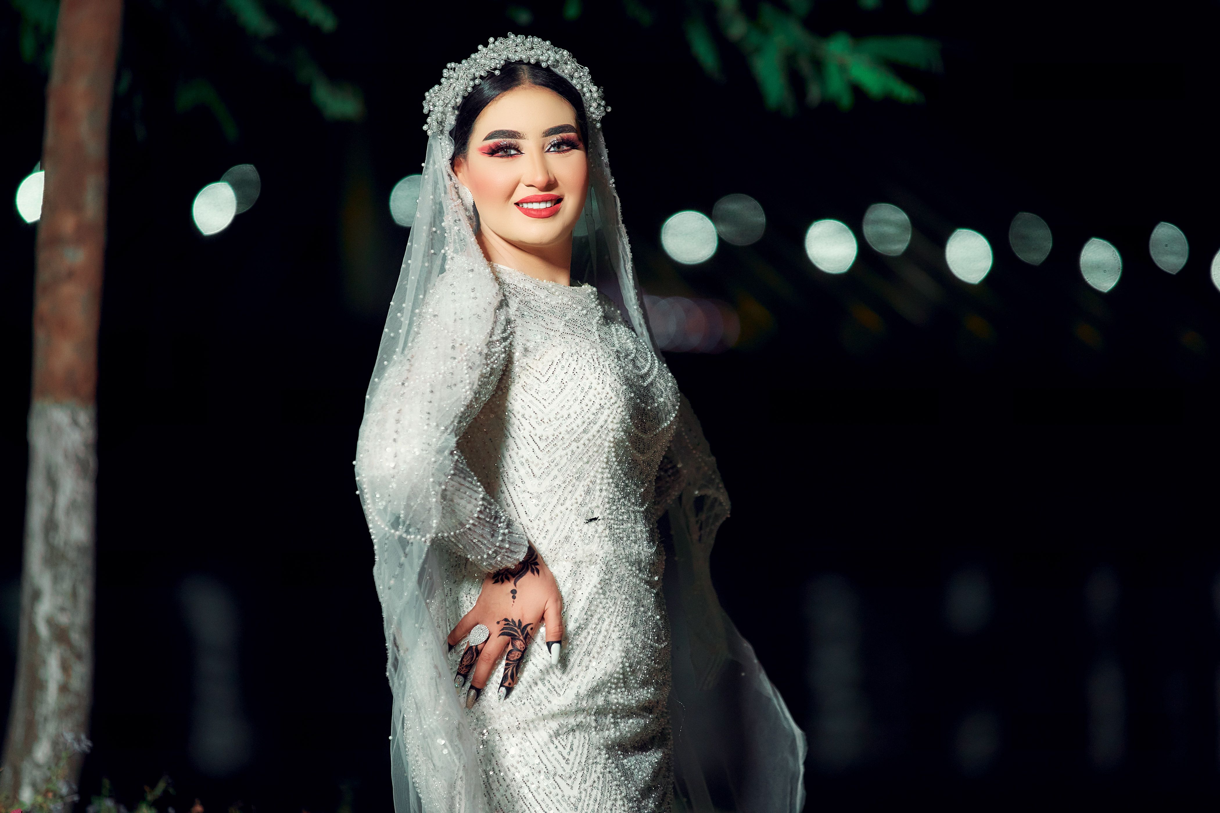 Smiling Bride in Wedding Dress at Night · Free Stock Photo