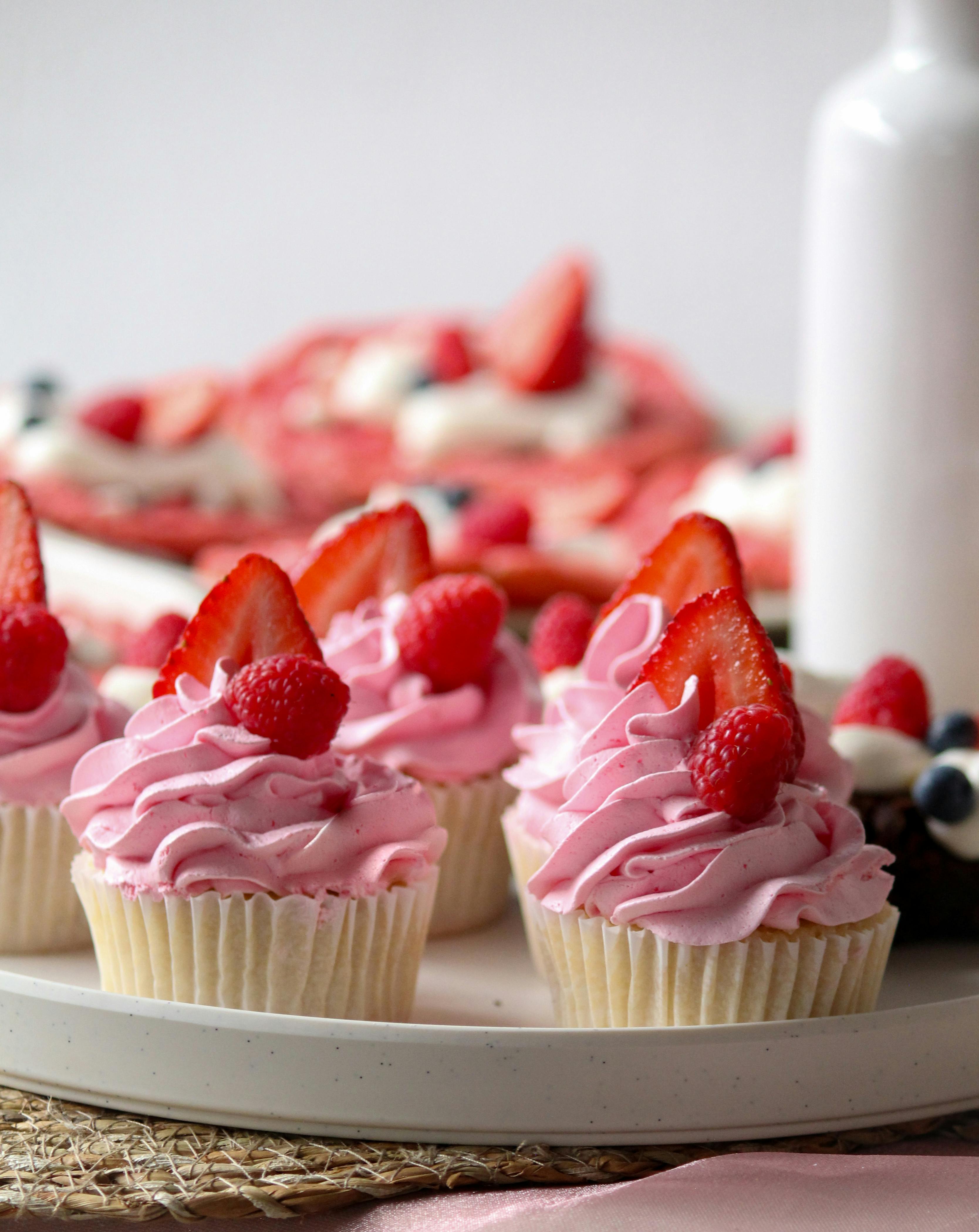 Crop person smearing cream on cake · Free Stock Photo