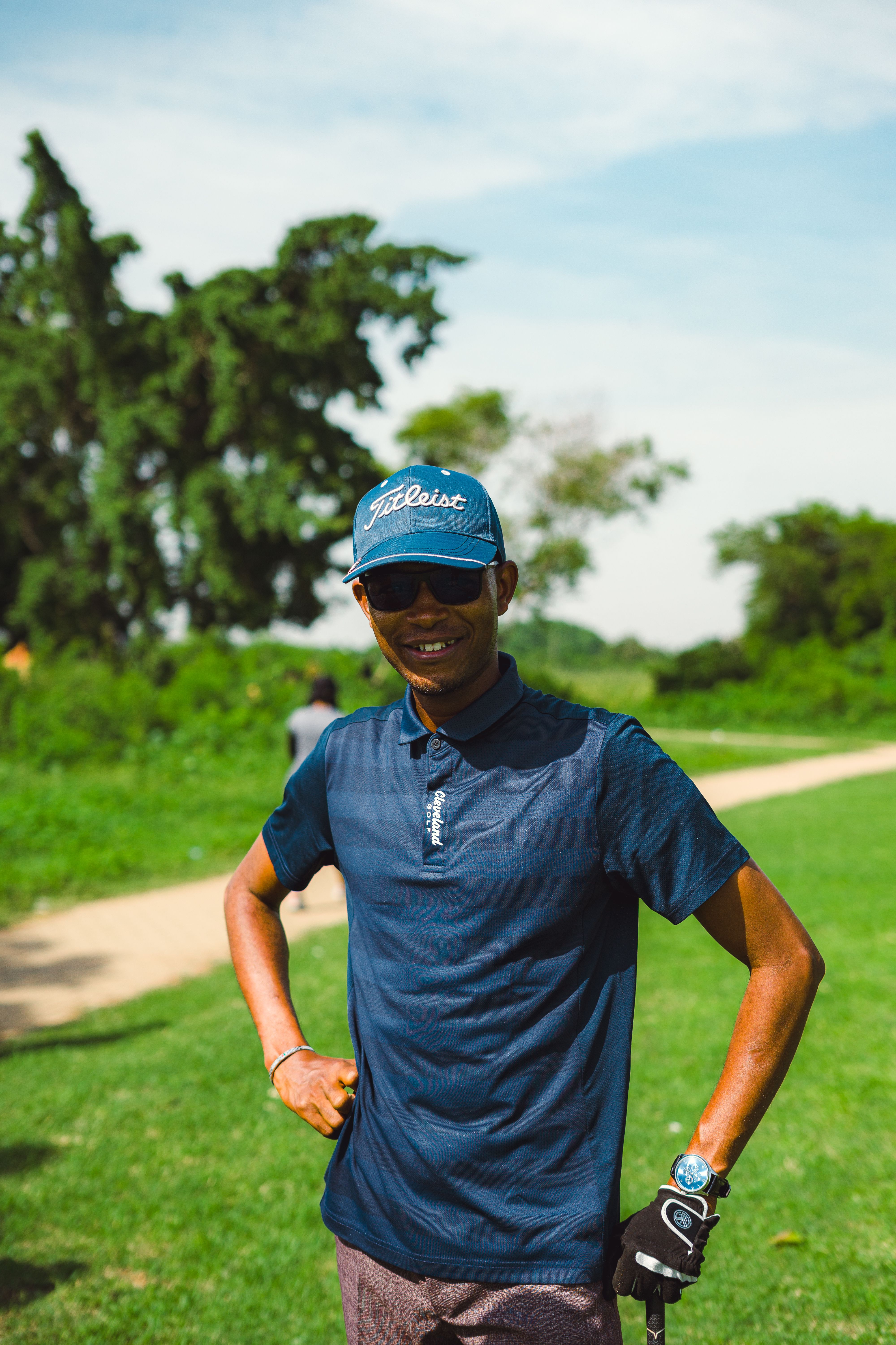 A Happy Man Standing on the Golf Course · Free Stock Photo