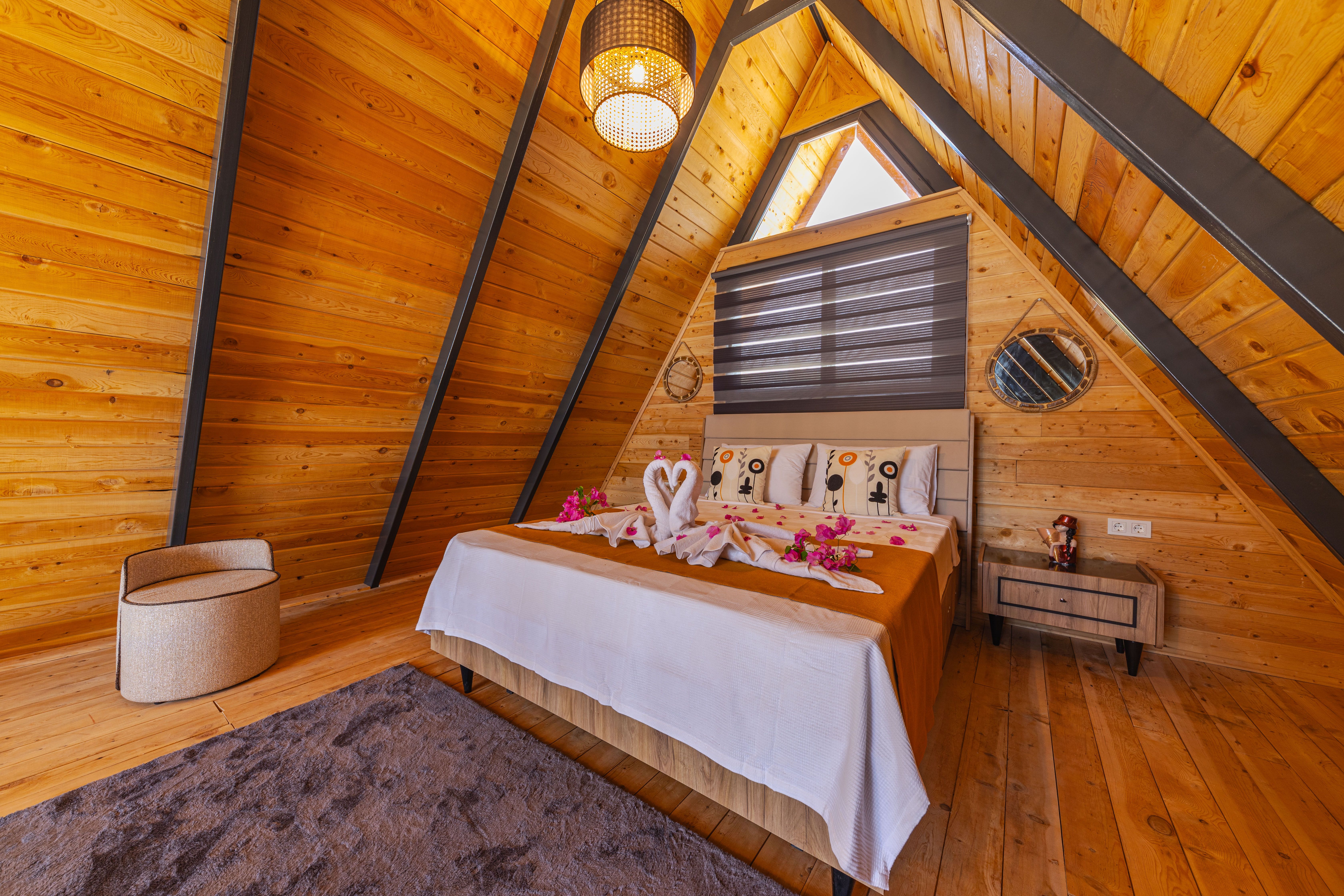 Attic Loft Bedroom with Rose Petals and Towel Swans in Wooden Cabin ...