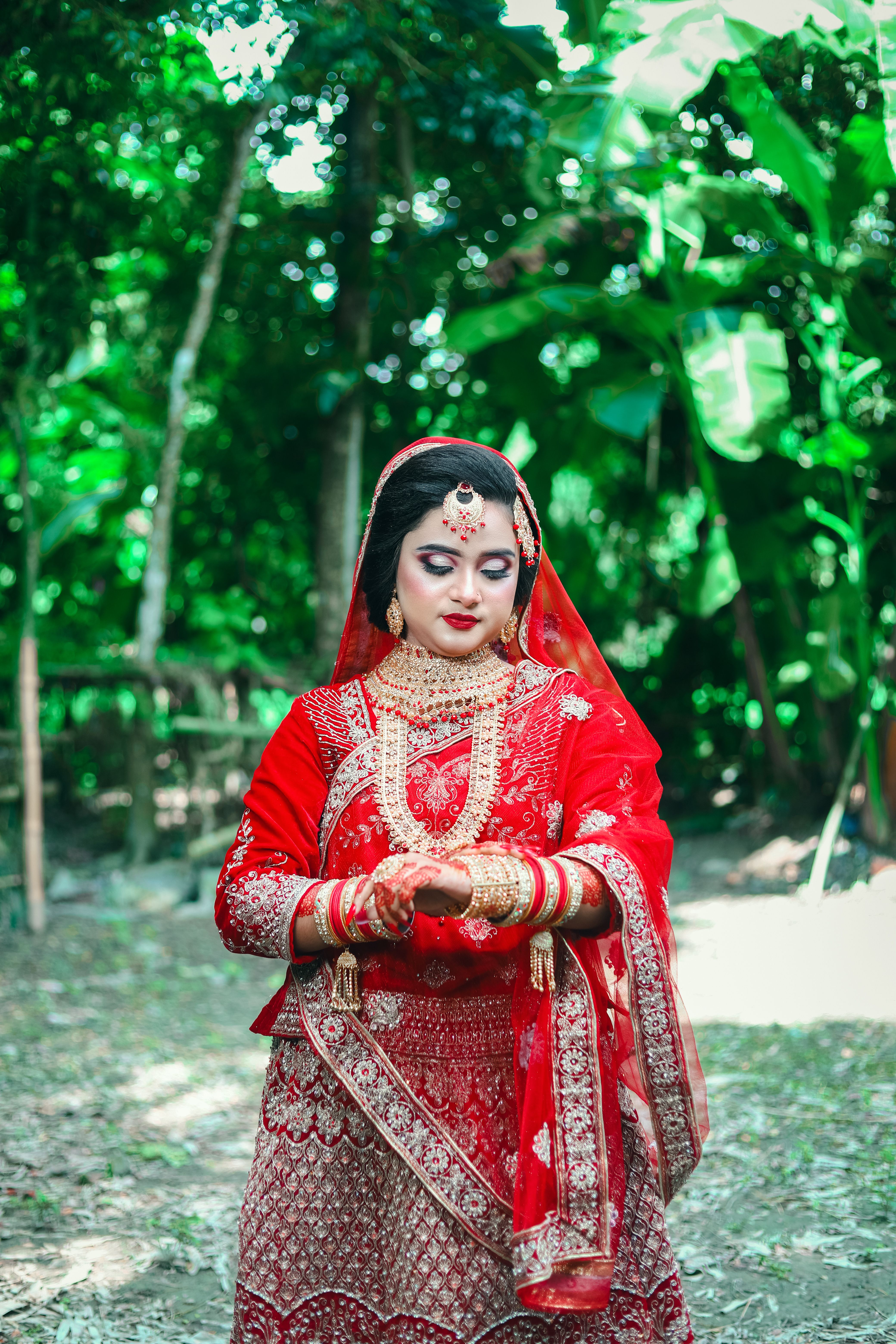 A beautiful indian bride in red and gold · Free Stock Photo