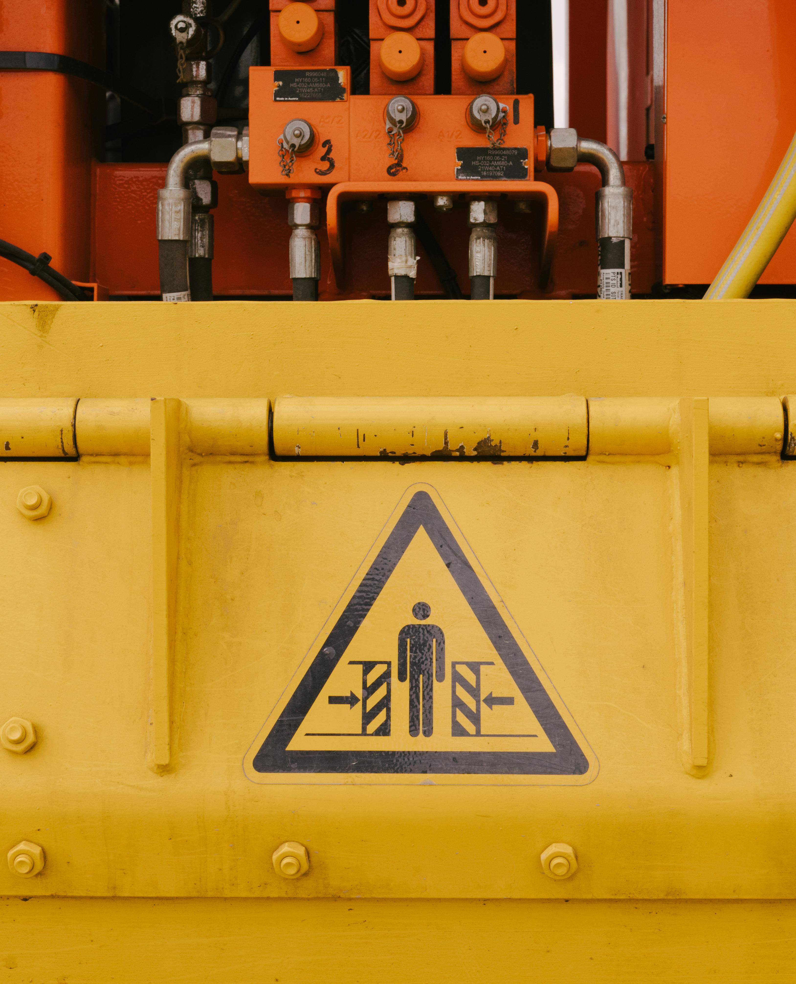 Warning Sign on a Piece of Equipment · Free Stock Photo
