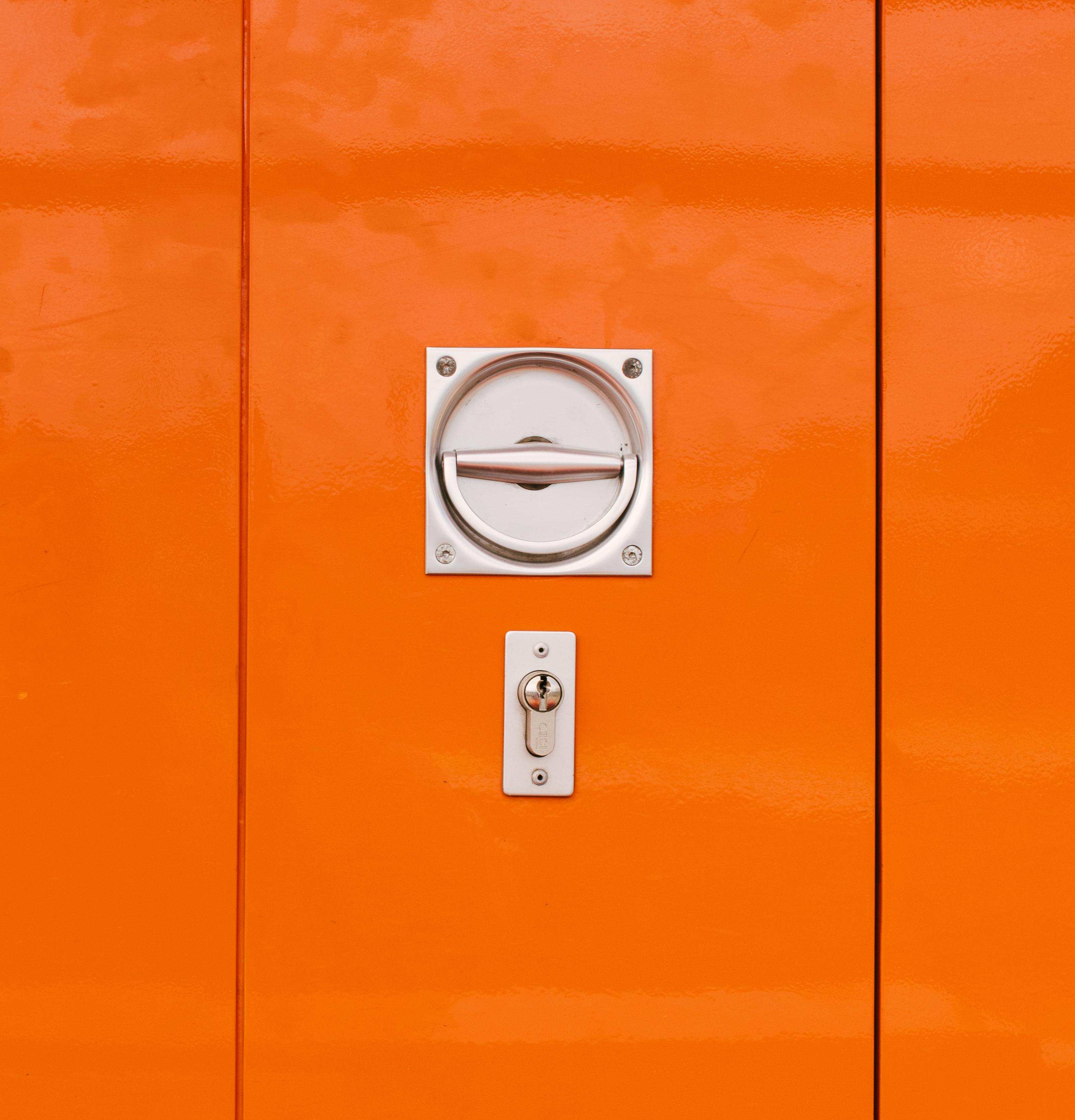 Orange Locker with a Lock and a Handle · Free Stock Photo
